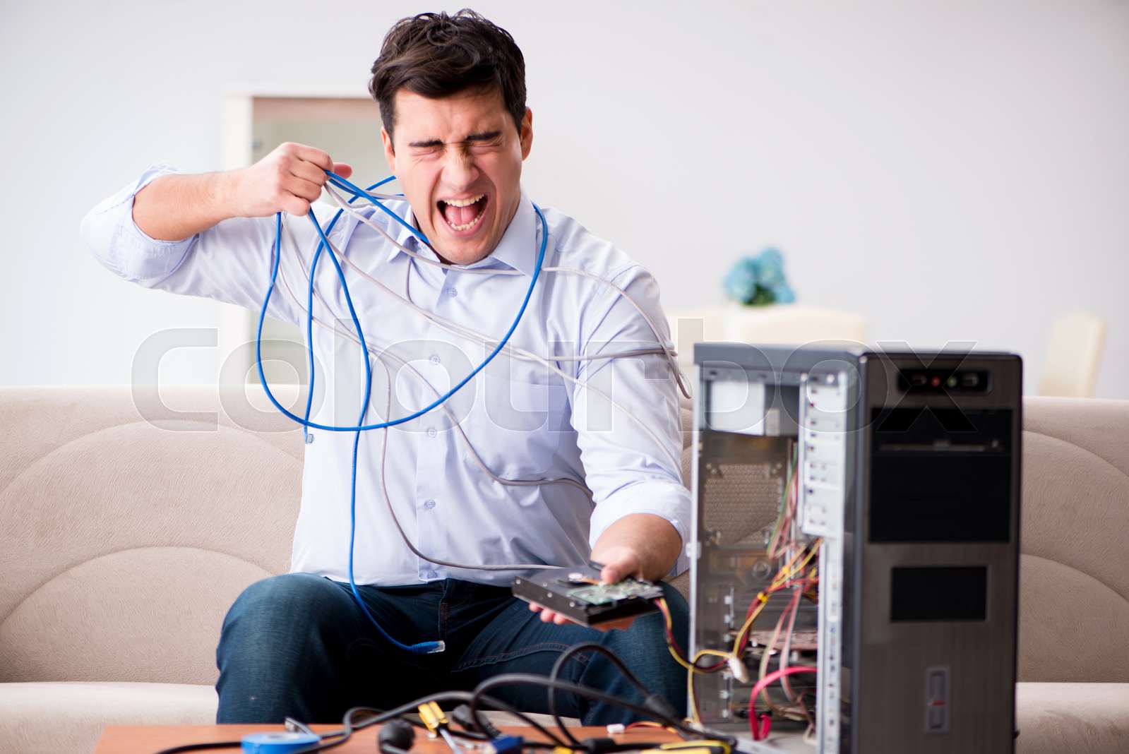Frustrated man with broken pc computer | Stock image | Colourbox