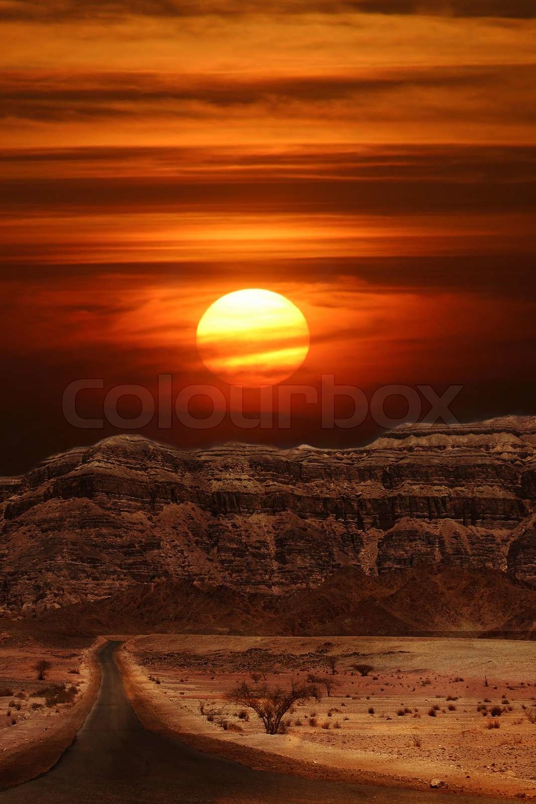 Vertical oriented image of sunset over the mountains of Arava desert in ...