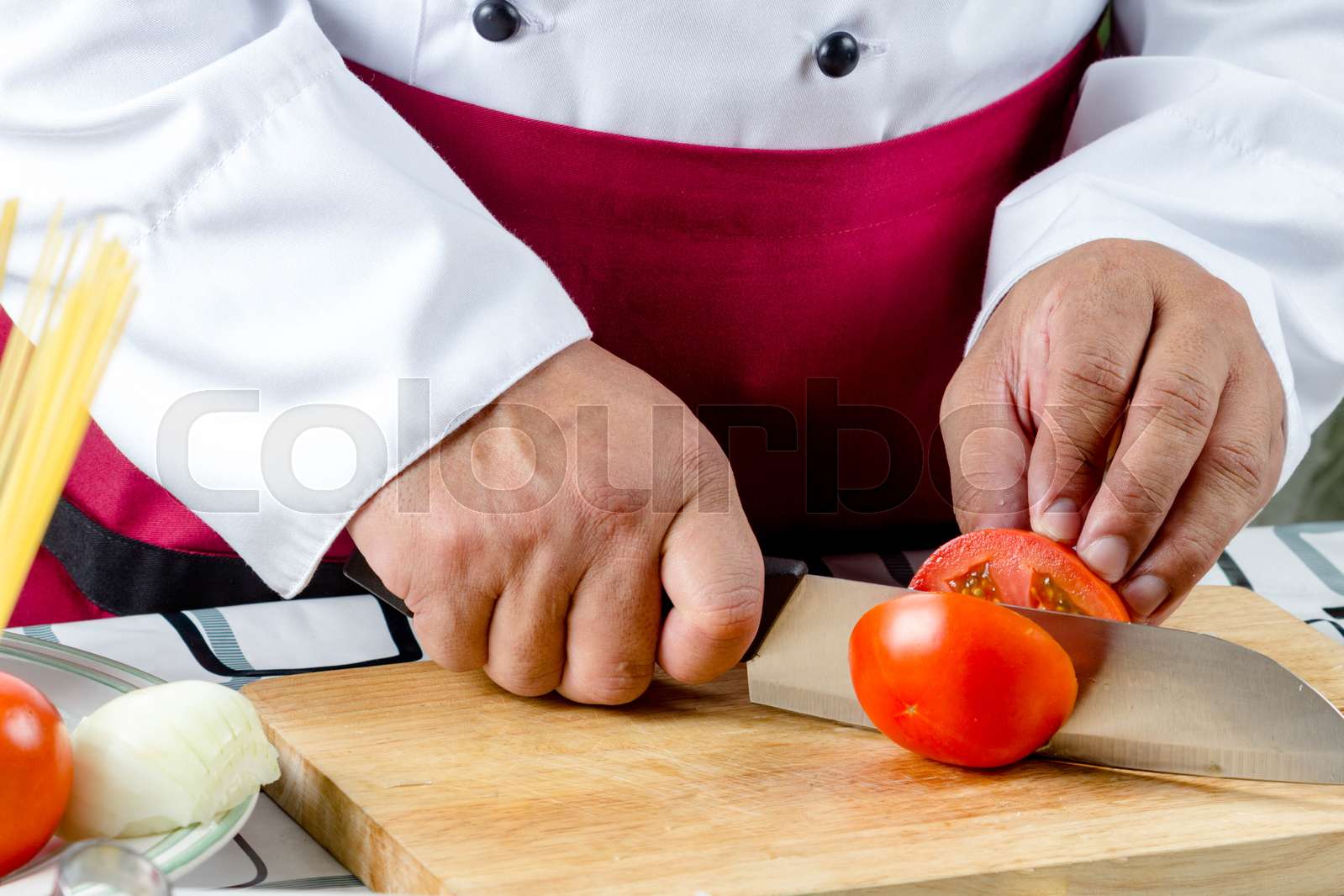 chef sliced tomato | Stock image | Colourbox