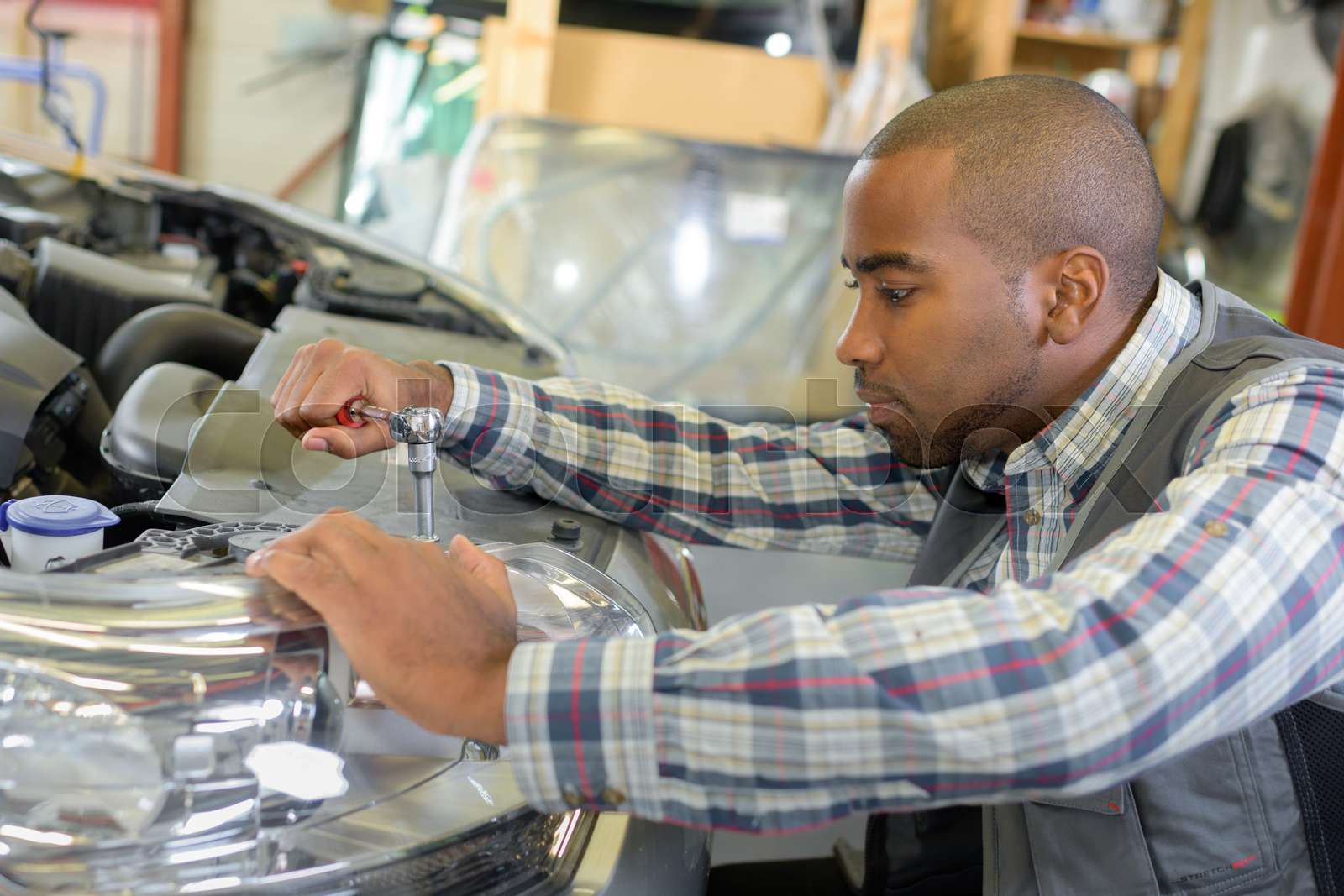 Man using ratchet | Stock image | Colourbox