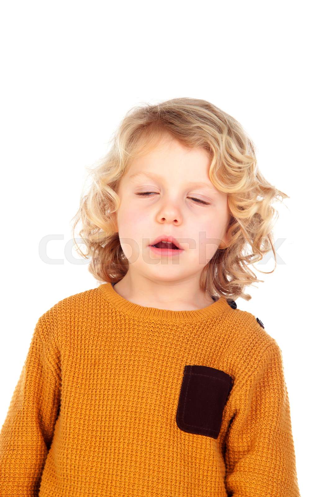 Small child closing his eyes | Stock image | Colourbox