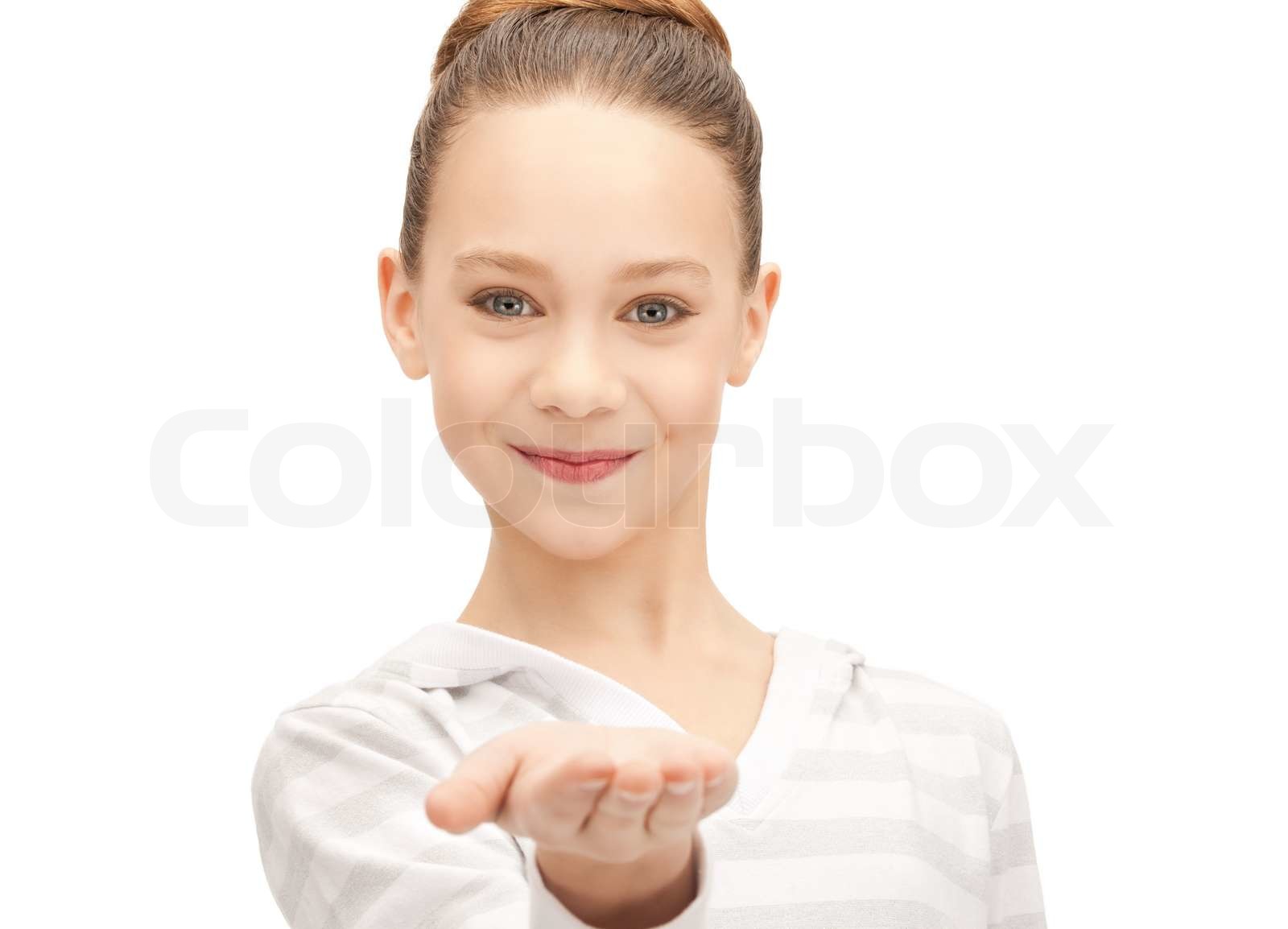 teenage girl showing something on the palm of her hand | Stock image ...