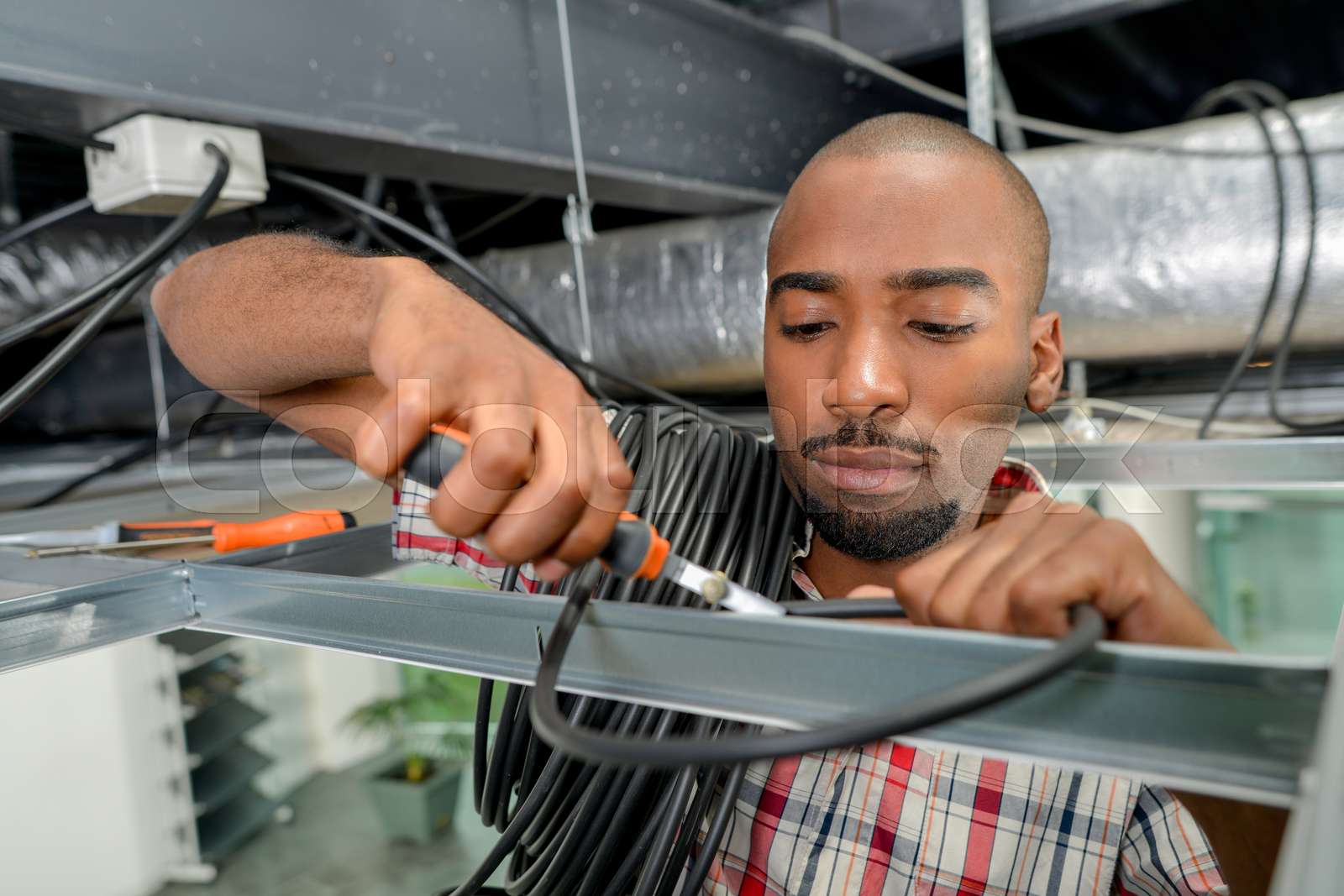 Electrician up a ladder | Stock image | Colourbox