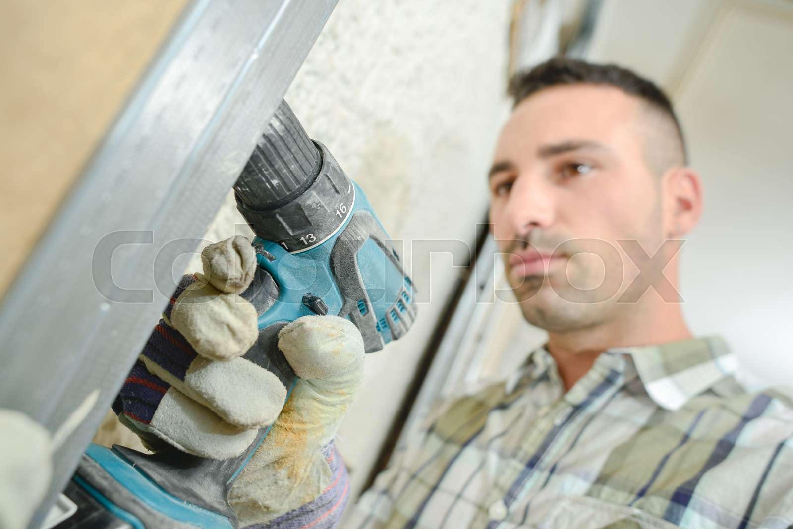 Man using power drill | Stock image | Colourbox