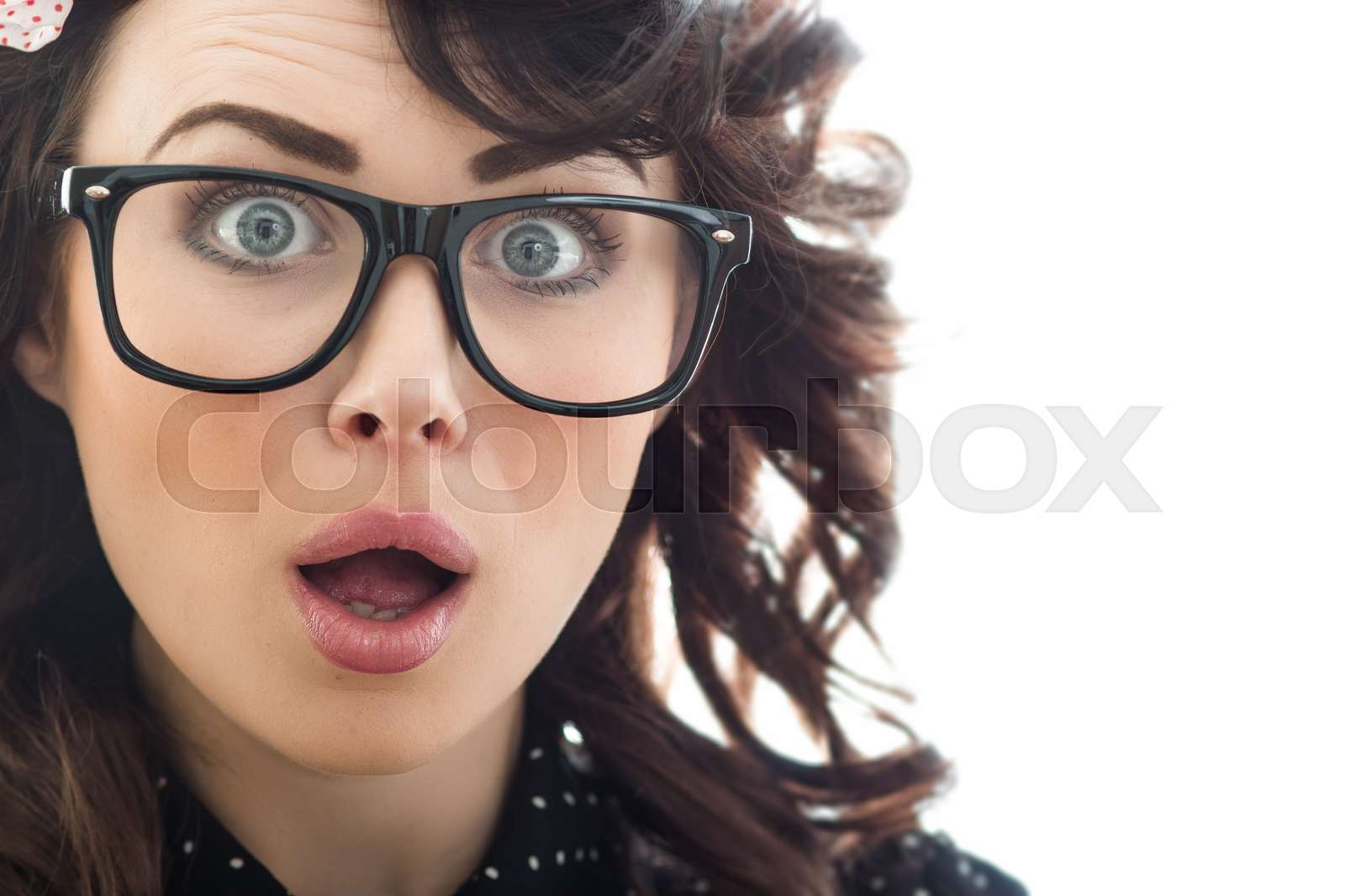 Amazedly young woman with open mout. Close up of surprised gril ...
