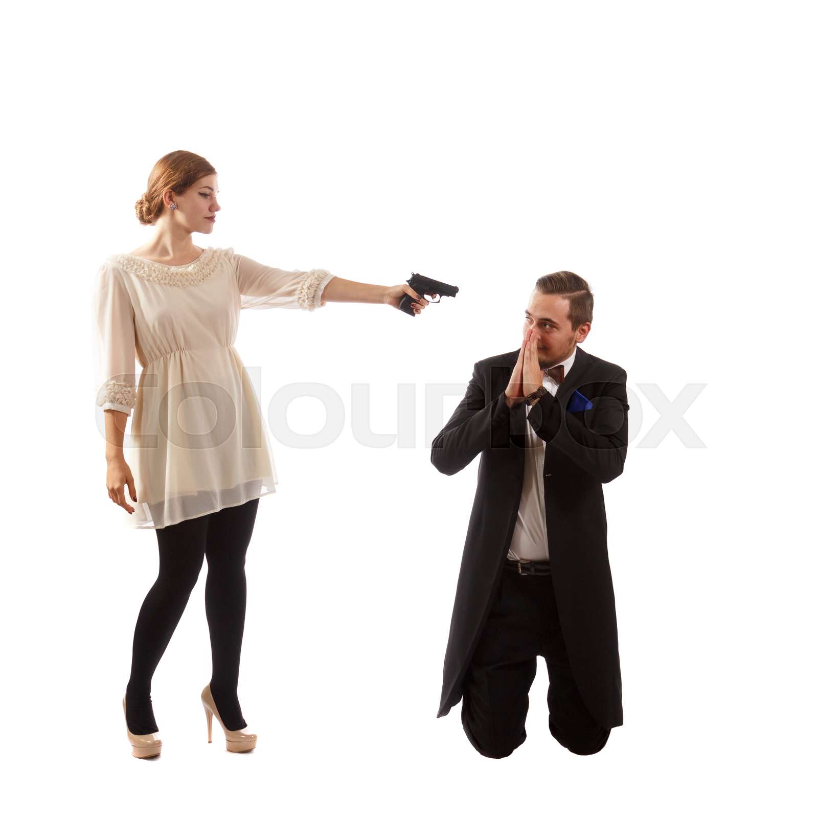 Lady shooting a man | Stock image | Colourbox