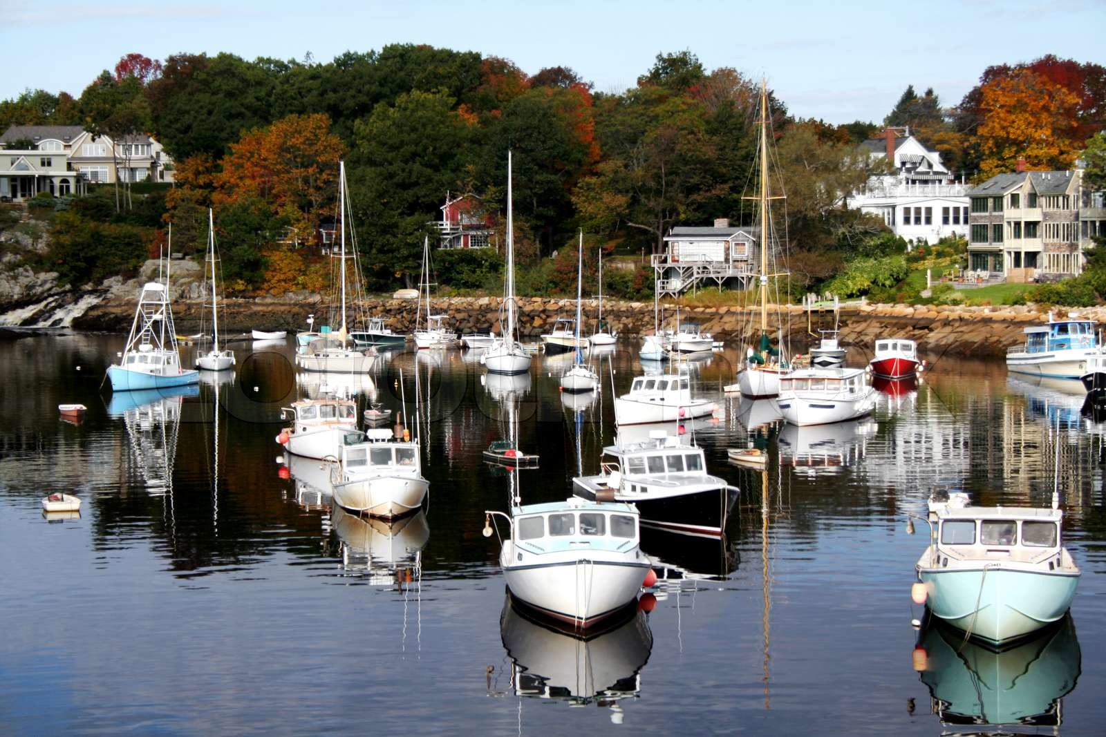 Fishing boats are docked in Perkins Cove, Maine in Autumn | Stock image ...