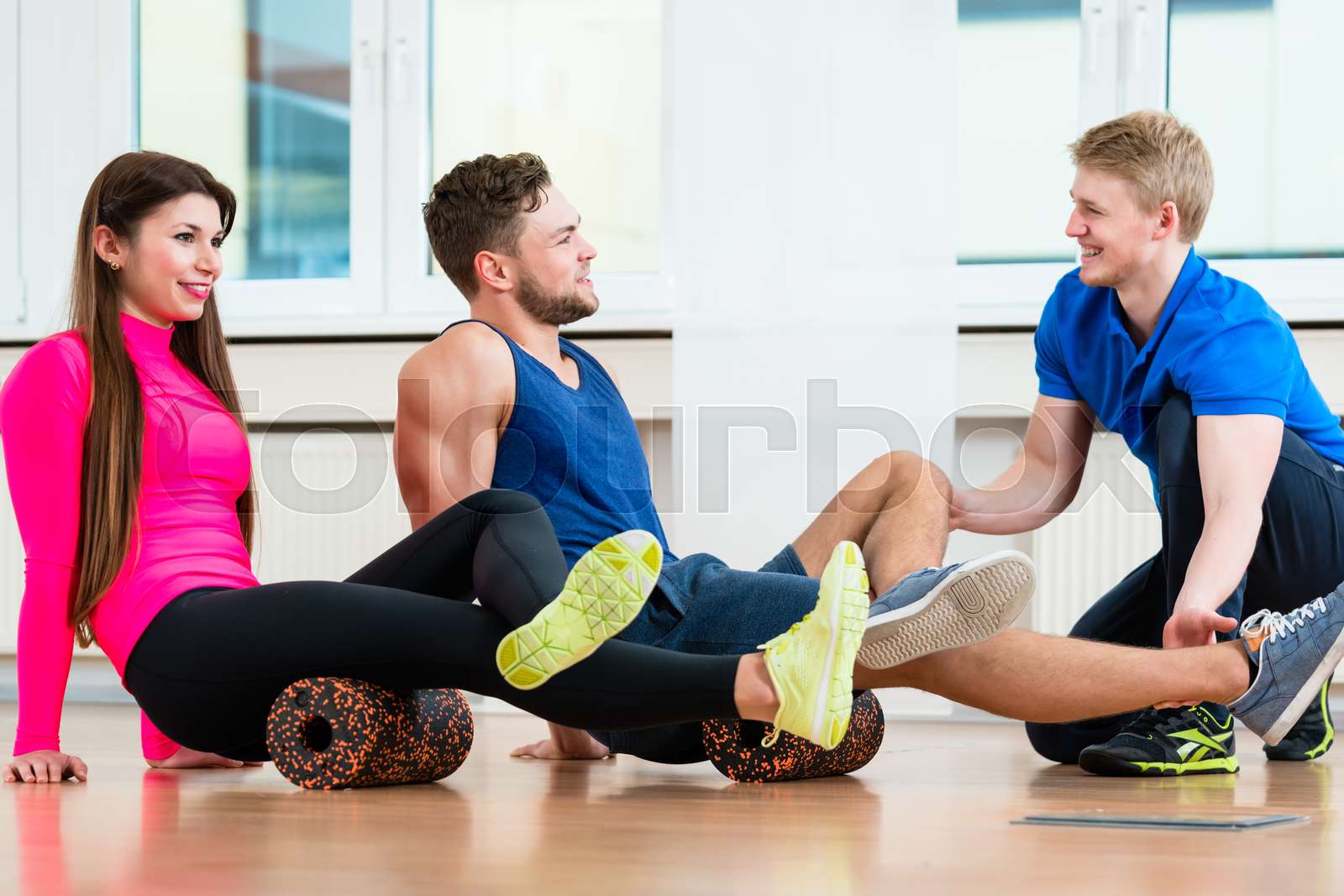 Physio Of Health Club Explaining Exercises With Roll Stock Image Colourbox physio-of-health-club-explaining-exercises-with-roll-stock-image-colourbox