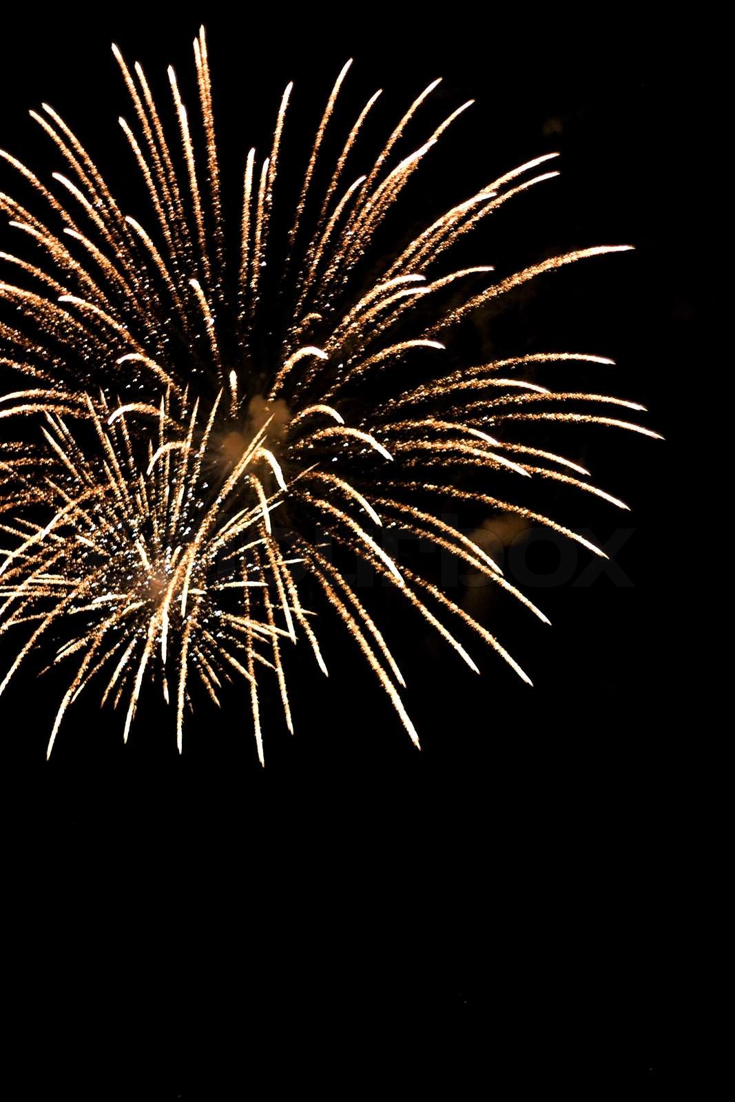 Beautiful fireworks exploding over a dark night sky. Plenty of ...