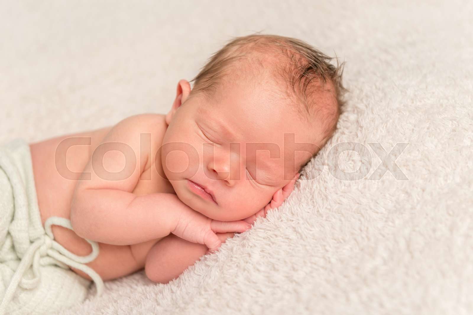 Kid napping peacefully | Stock image | Colourbox