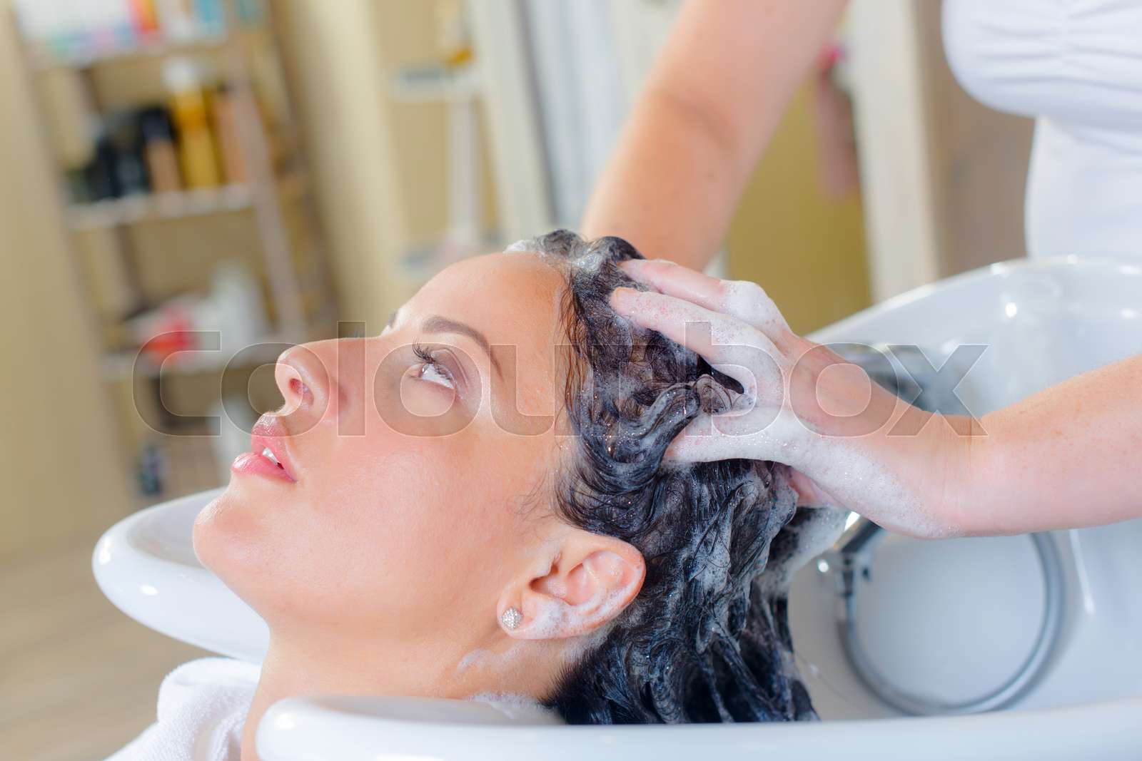 Lady having hair washed | Stock image | Colourbox