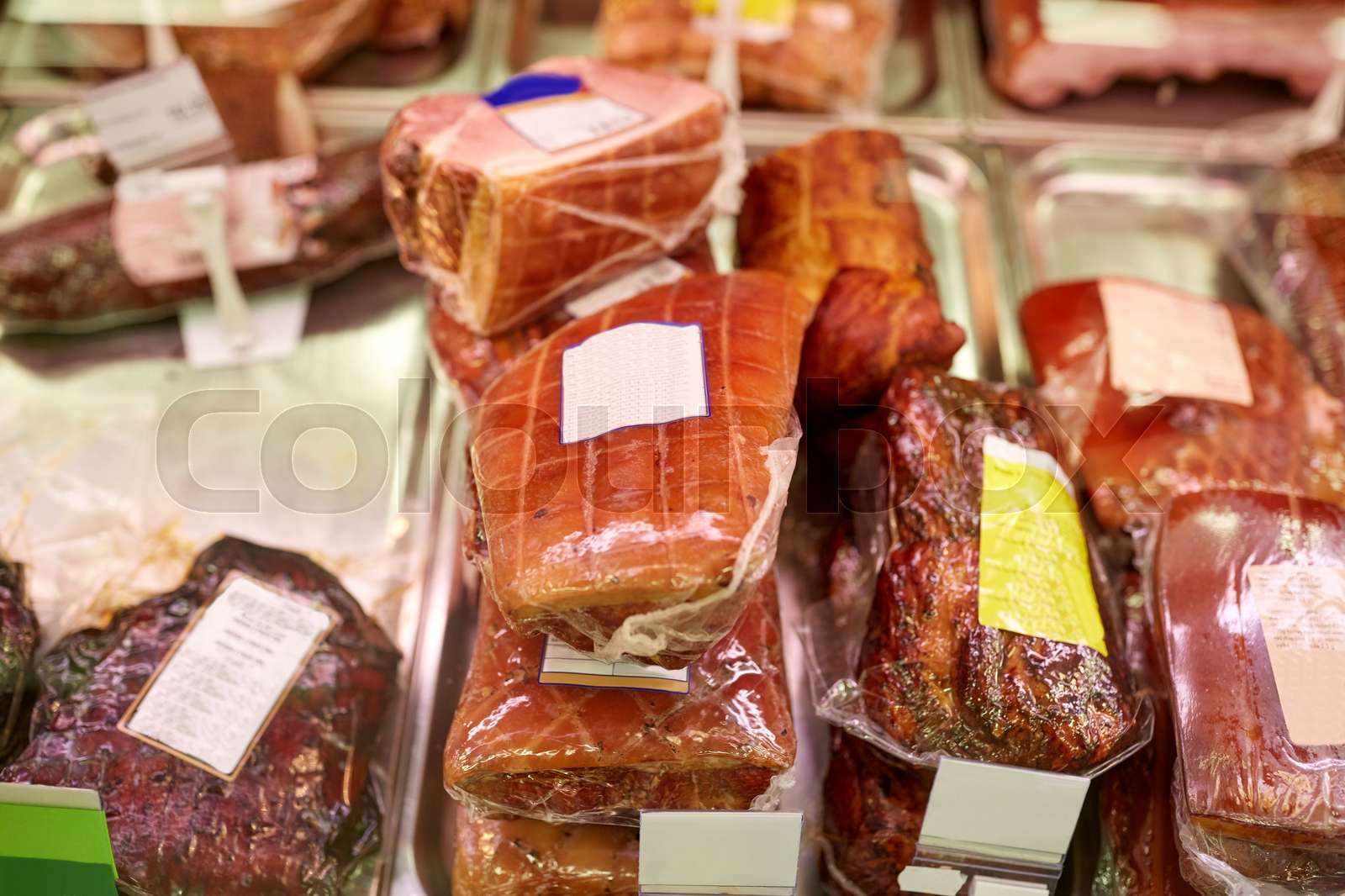 ham at grocery store stall | Stock image | Colourbox