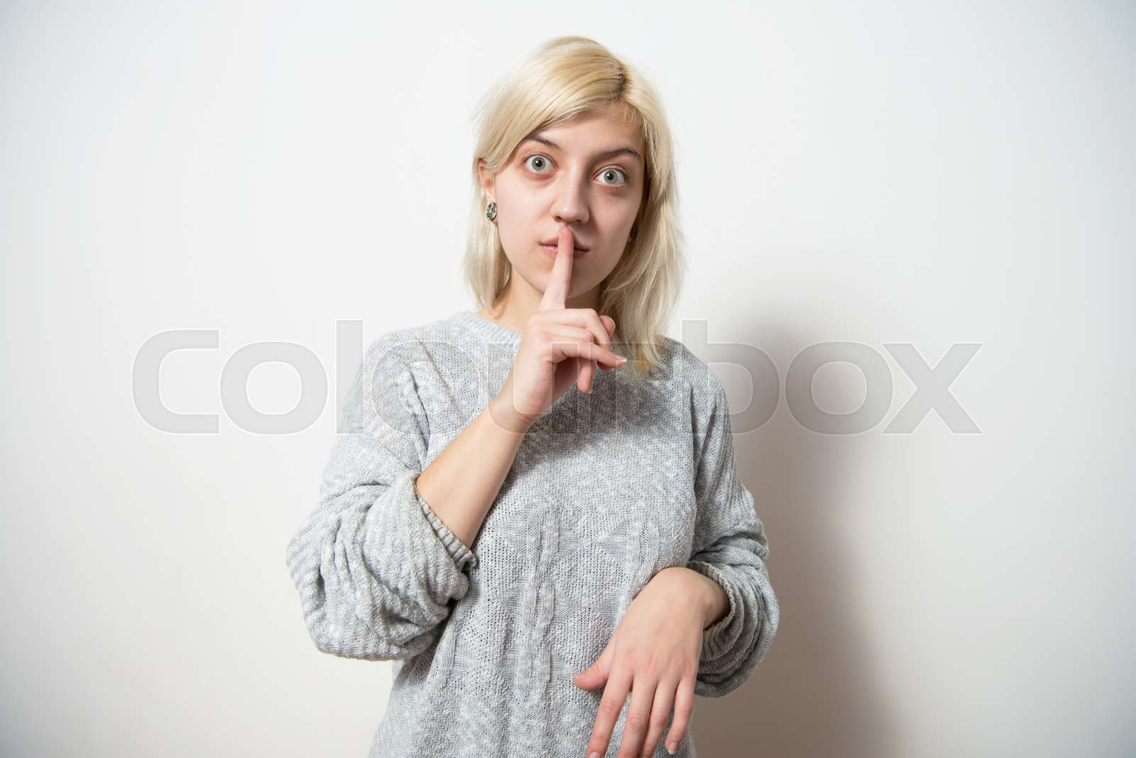 woman put finger on her lips | Stock image | Colourbox