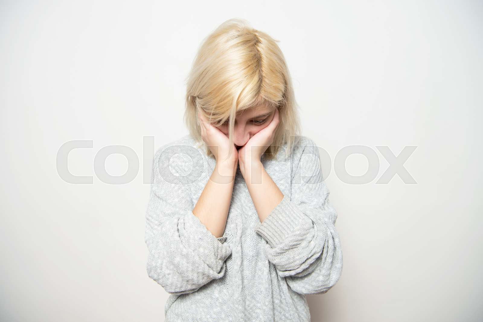 fatigue of a young girl in a photo studio. Pain, depression, fatigue ...