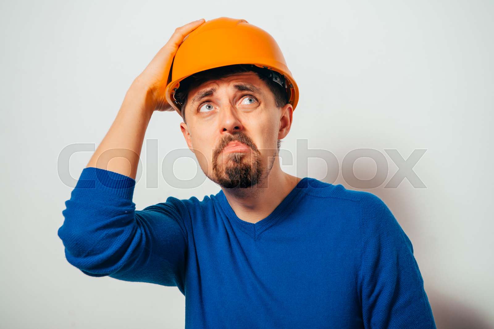builder helmet. Man | Stock image | Colourbox