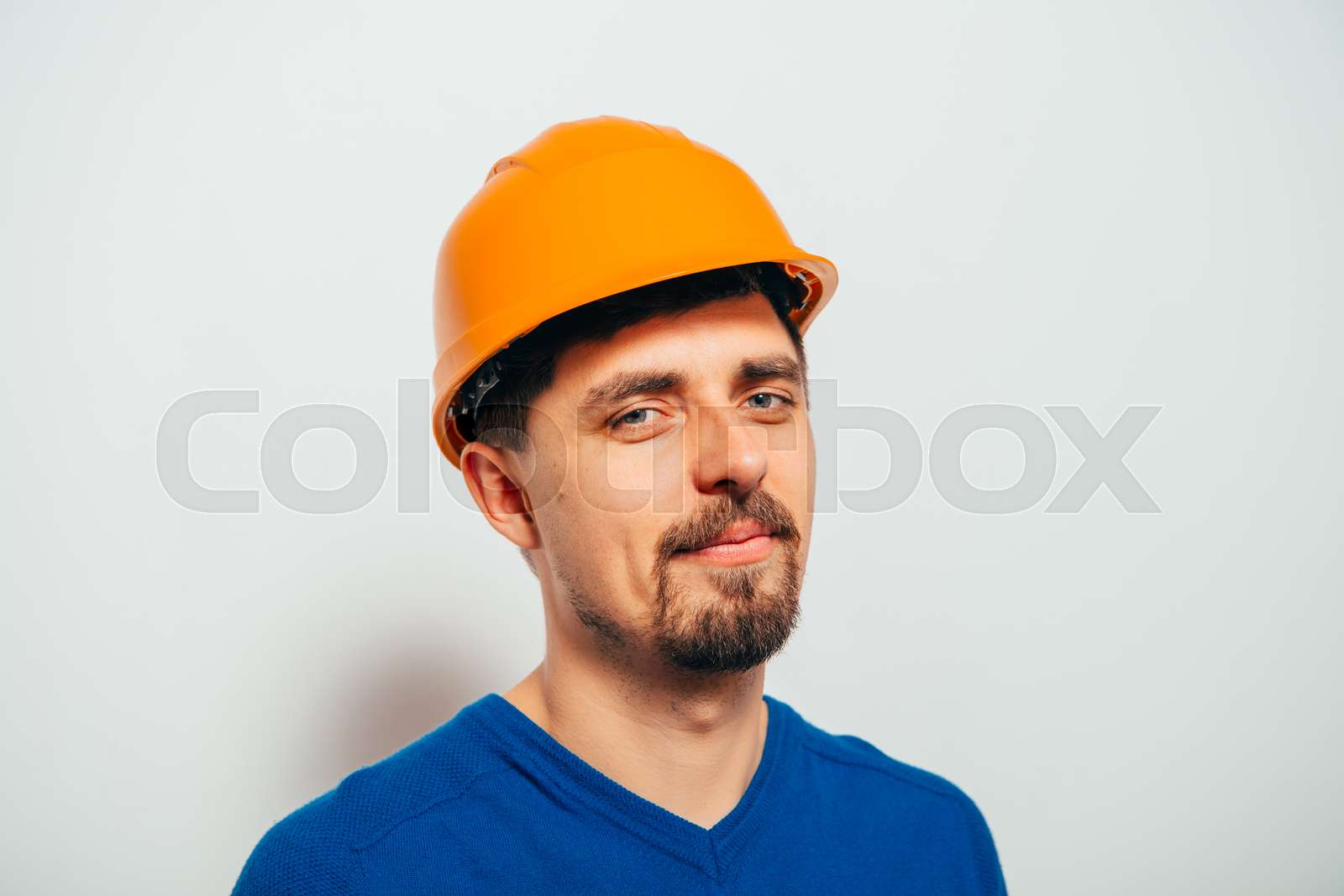 builder helmet. Man | Stock image | Colourbox