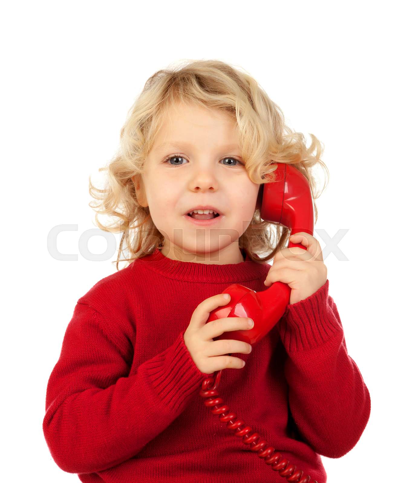 Funny little child talking on the phone | Stock image | Colourbox