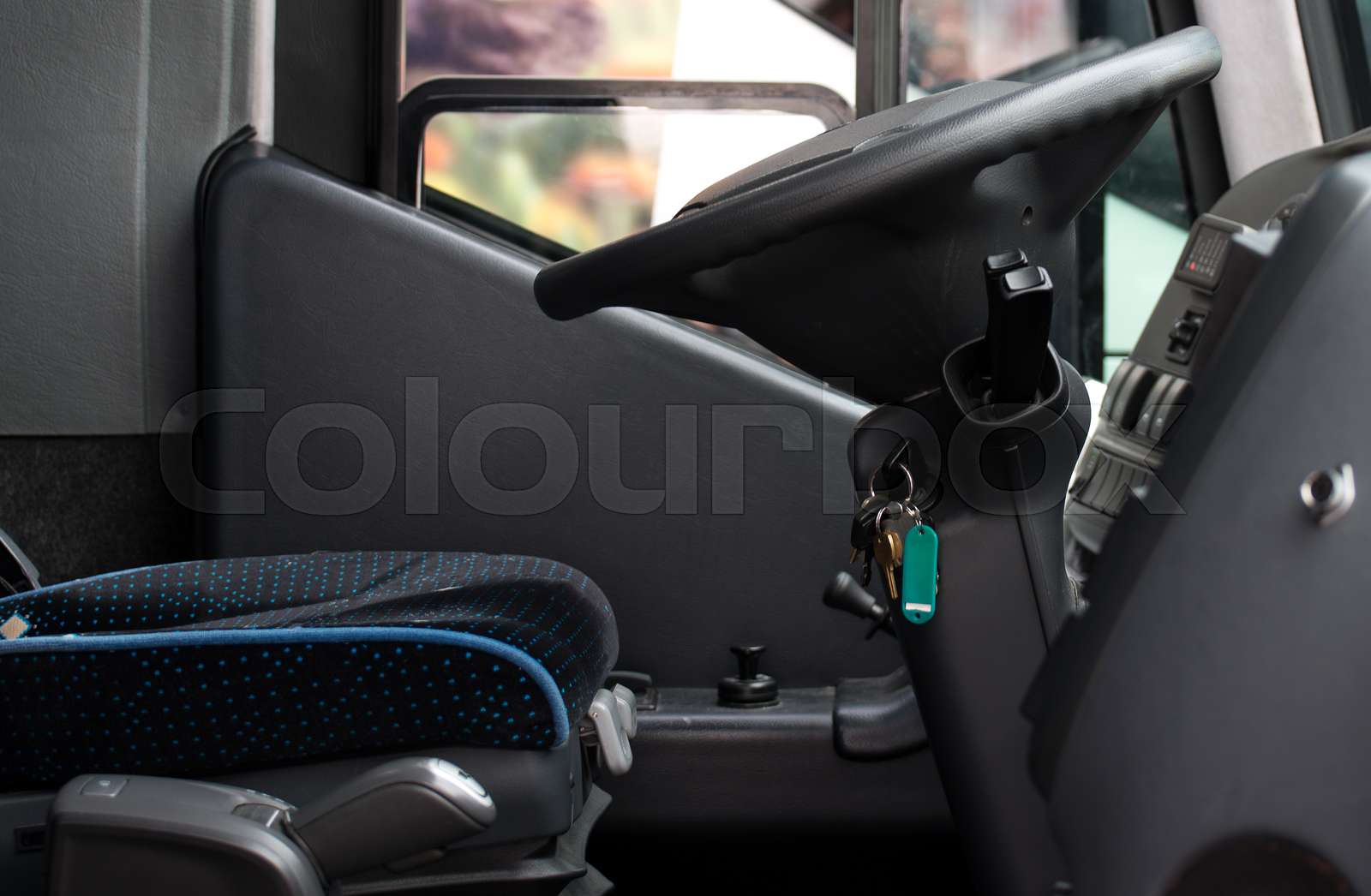 Seat and steering wheel. Bus driver's seat. | Stock image | Colourbox