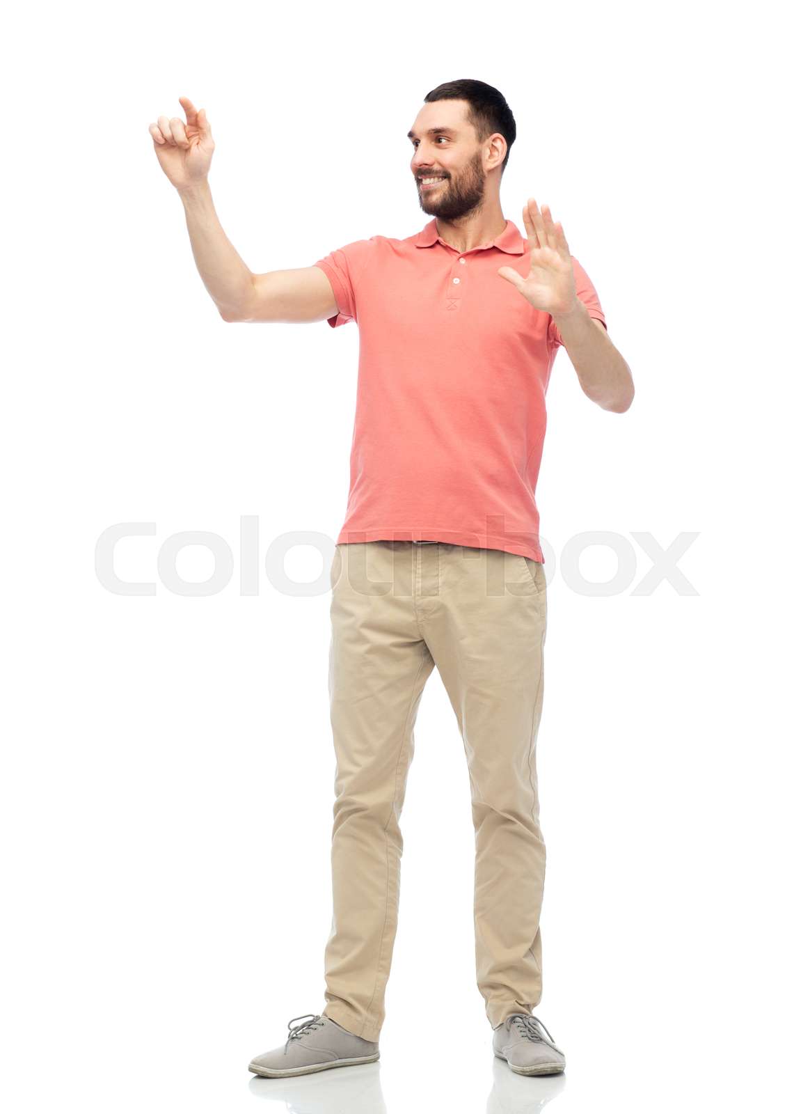 happy man touching something imaginary | Stock image | Colourbox