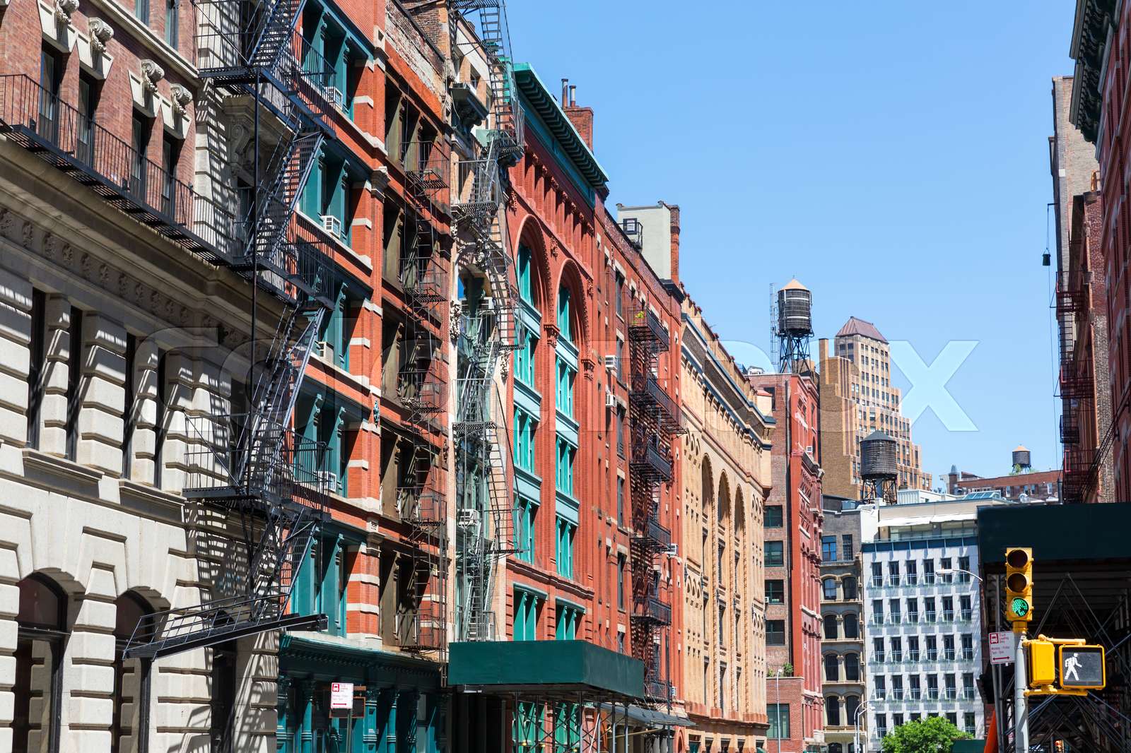 Street with brick buildings and skyscraper. | Stock image | Colourbox