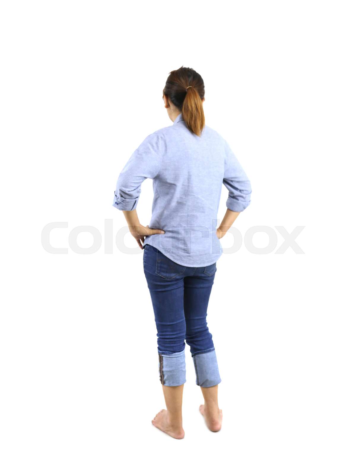Back of woman standing and akimbo | Stock image | Colourbox