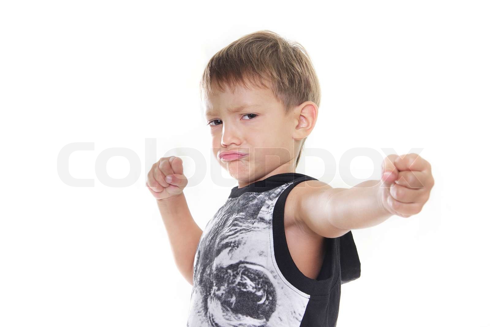 young aggressive boy over white | Stock image | Colourbox