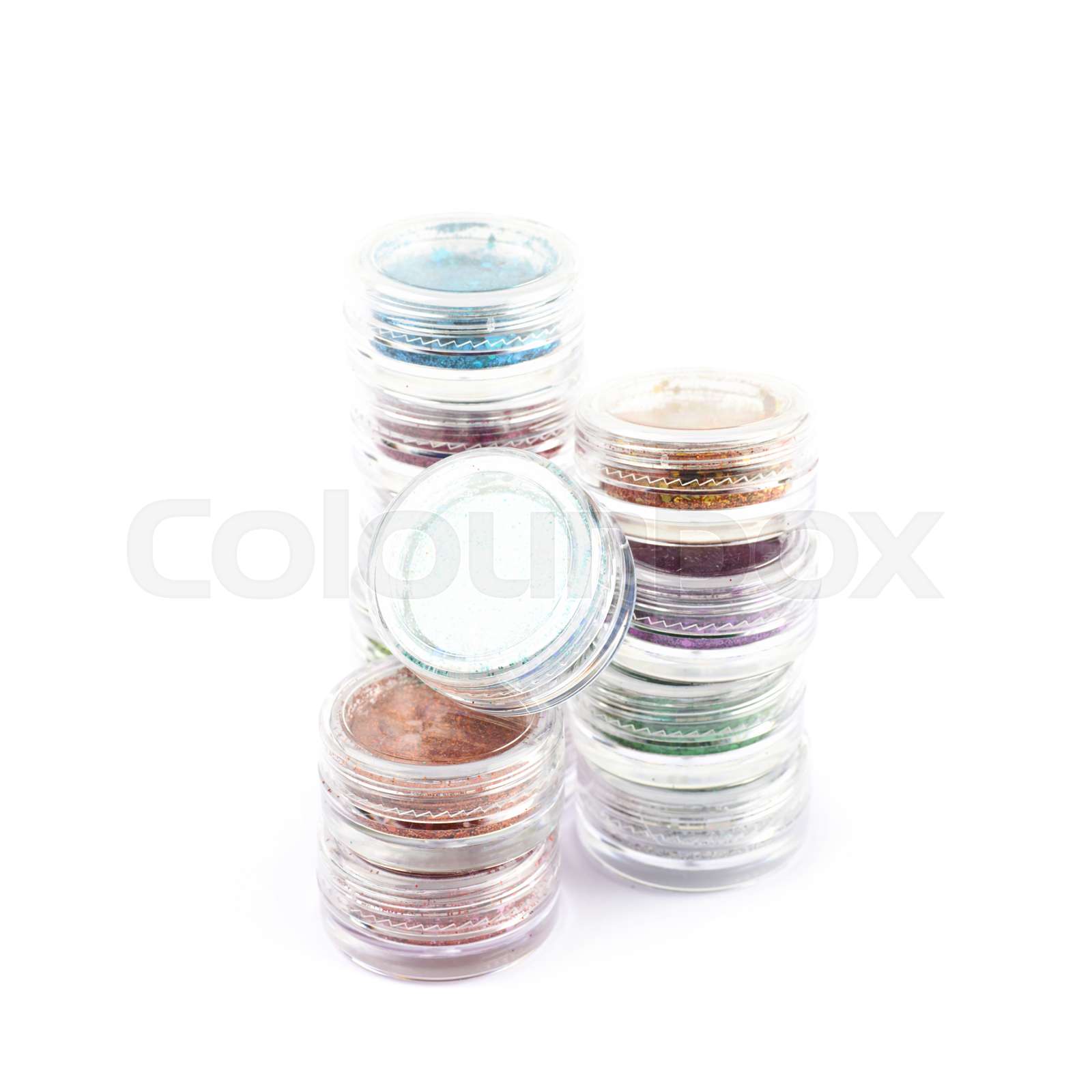 Pile of round sequin boxes isolated | Stock image | Colourbox