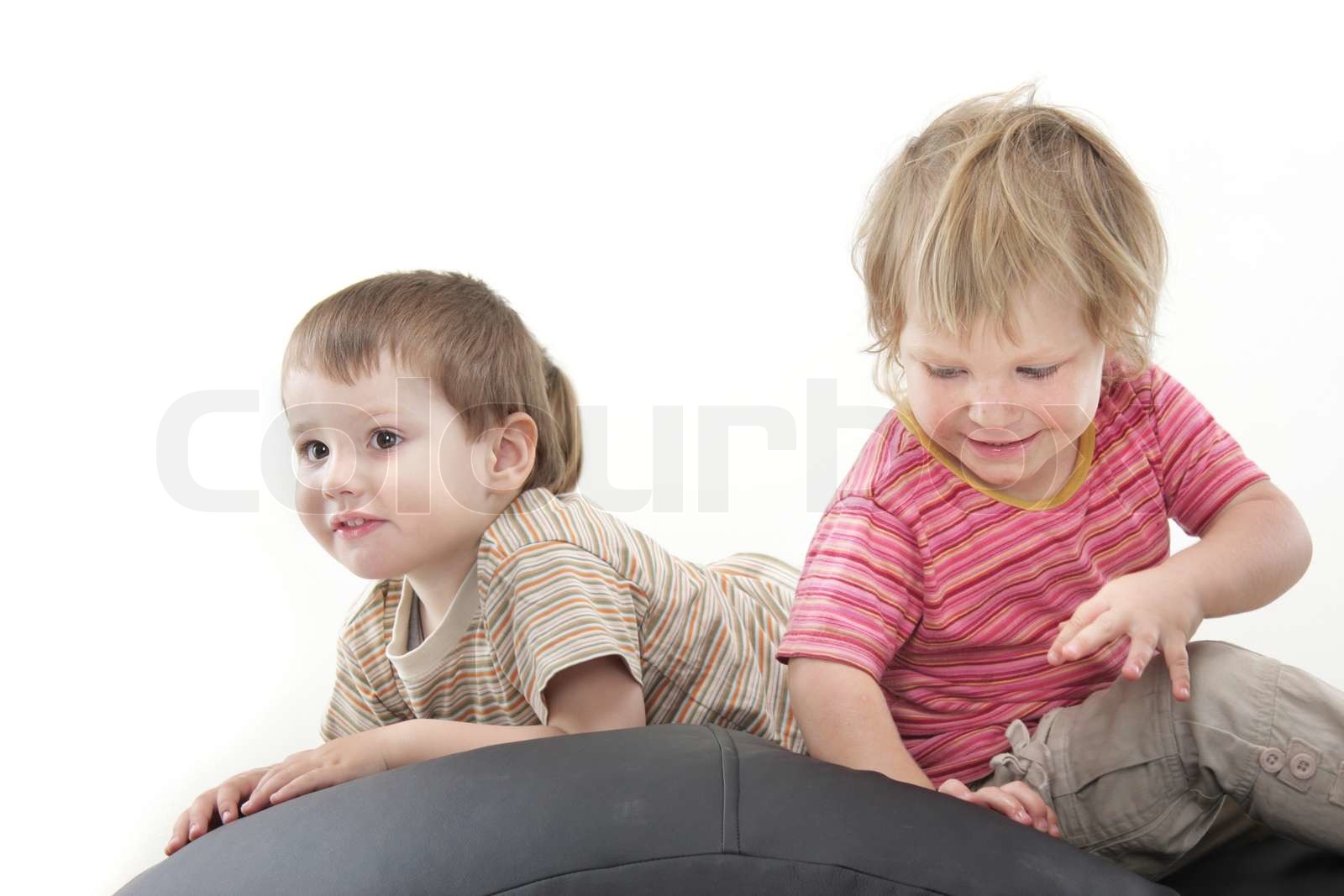 two children playing over white | Stock image | Colourbox