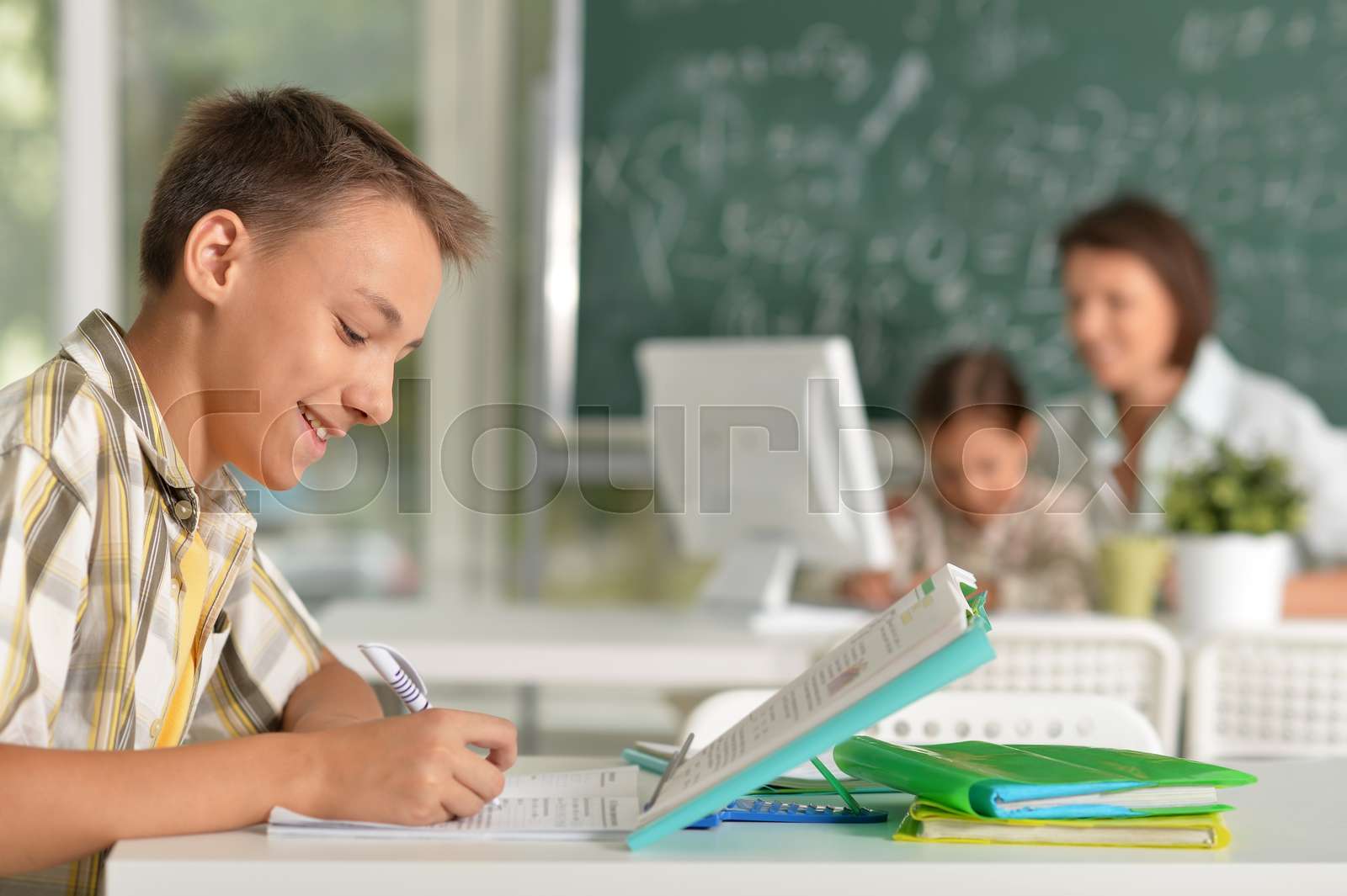 teenage boy doing lessons | Stock image | Colourbox