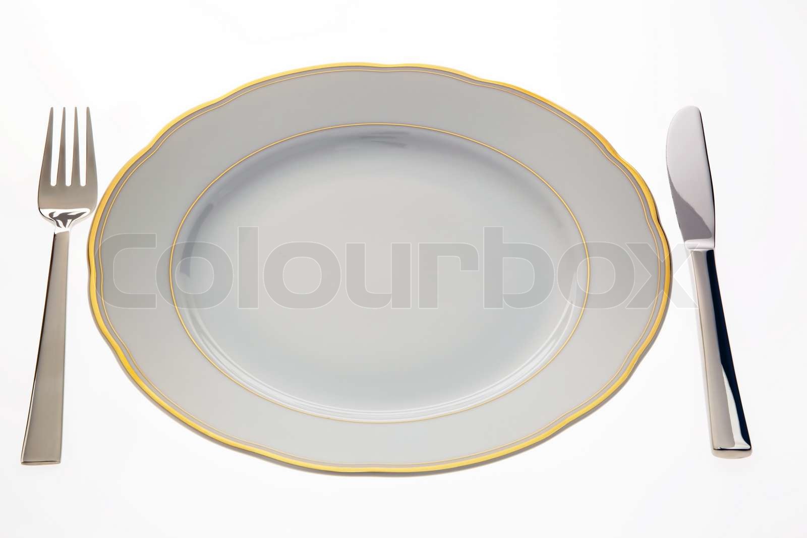 En kniv med en gaffel og plade Placer indstilling til en middag på ...