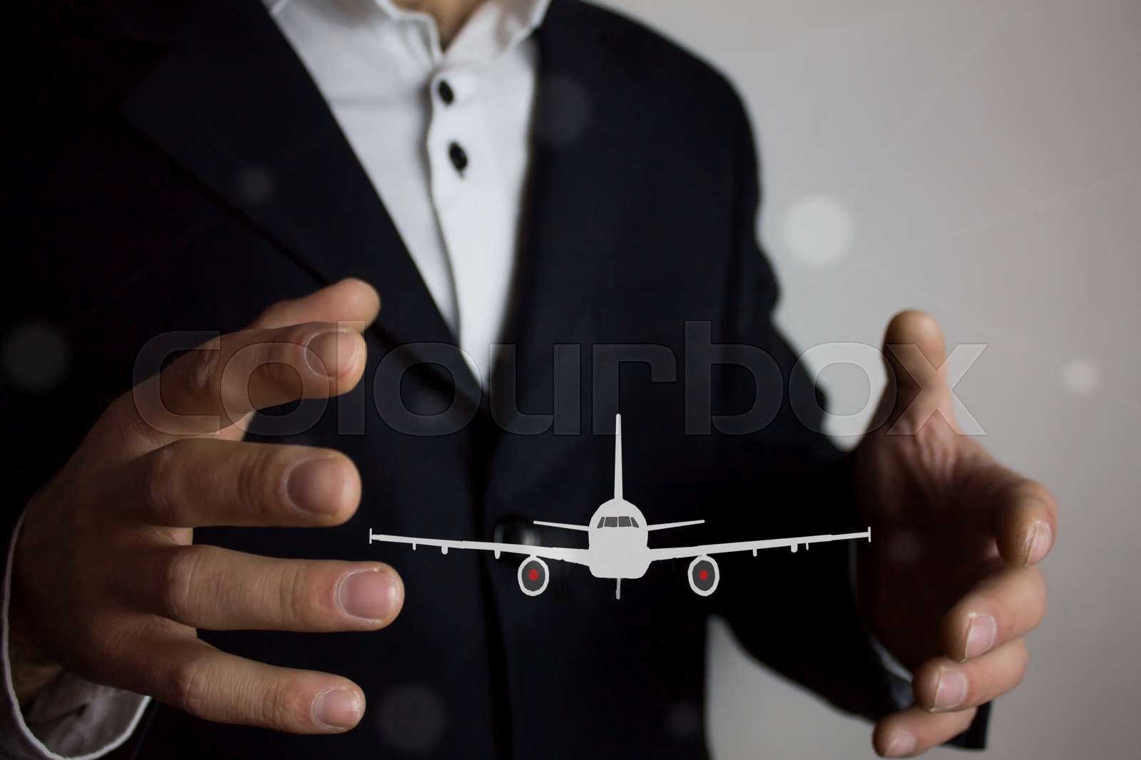 airplane on businessman hands | Stock image | Colourbox