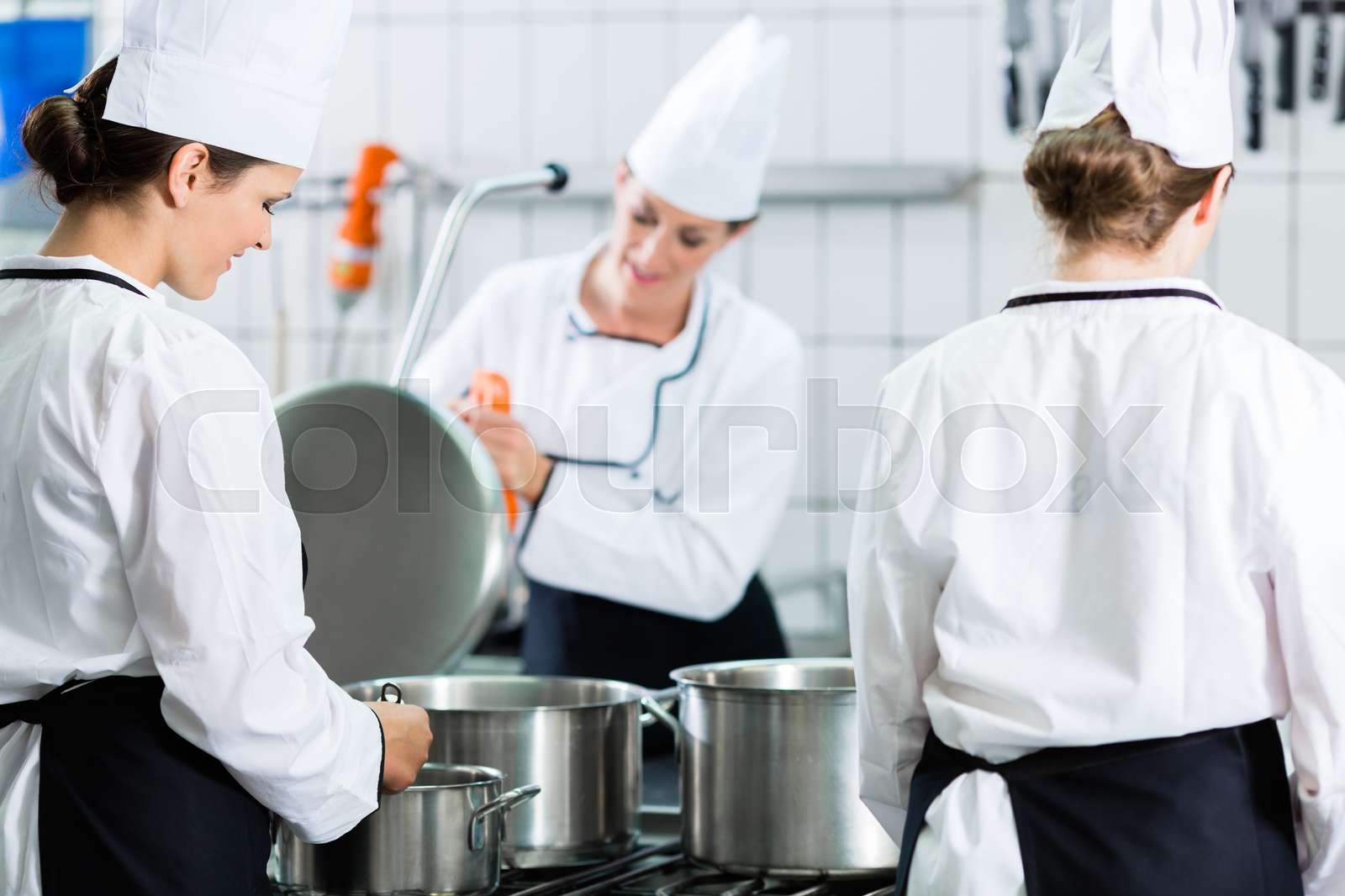 Canteen kitchen with chefs during service | Stock image | Colourbox