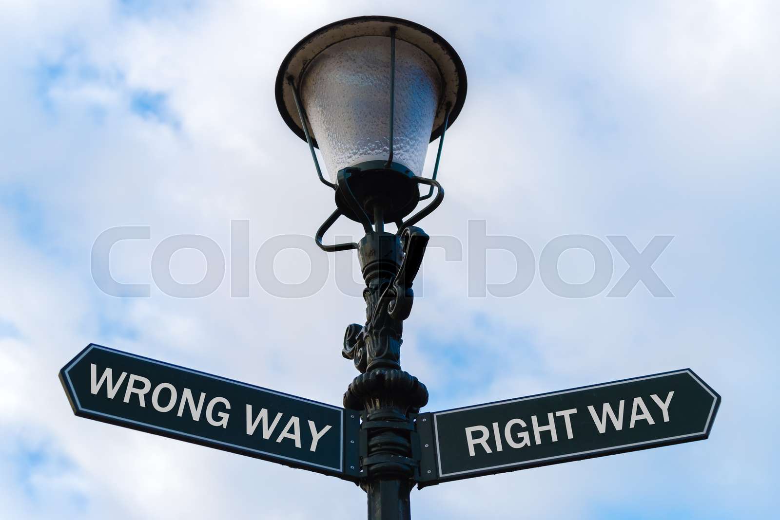 Wrong Way versus Right Way directional signs on guidepost | Stock image ...