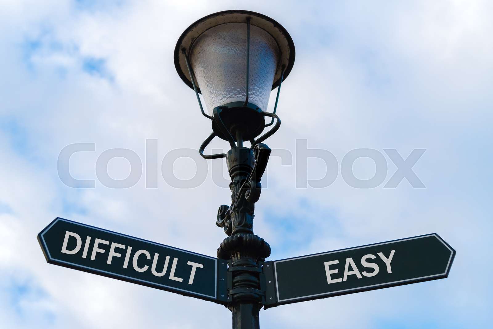 Difficult versus Easy directional signs on guidepost | Stock image ...