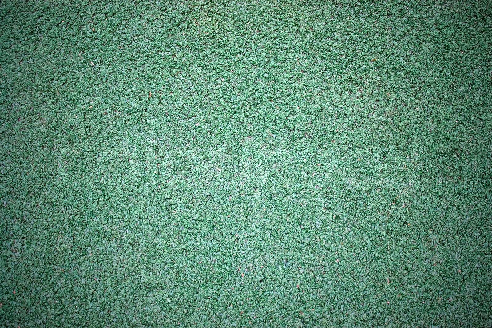 A green artificial astro turf texture commonly used in ball sports ...