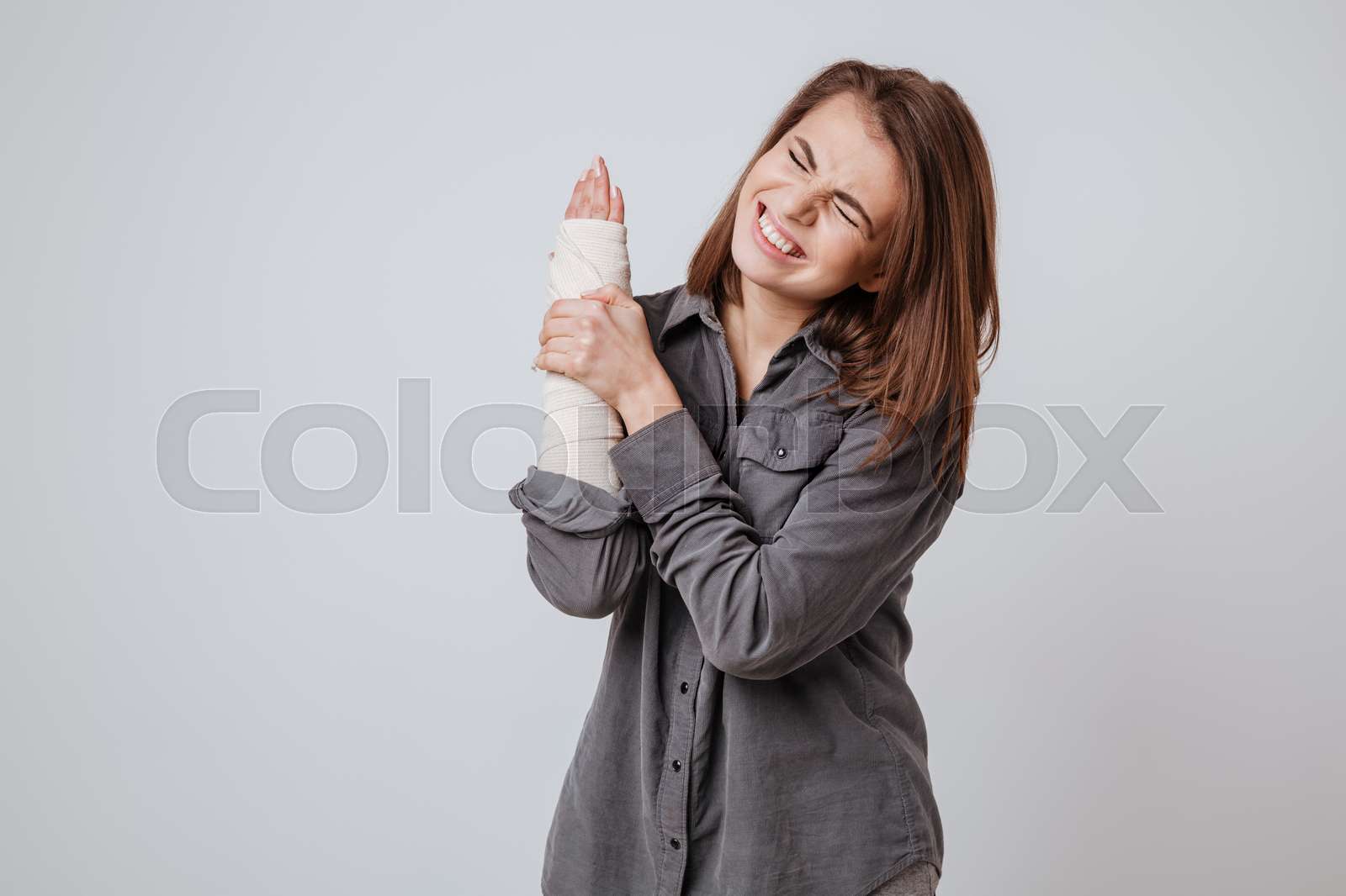 Sick screaming young woman with the plaster on hand | Stock image ...