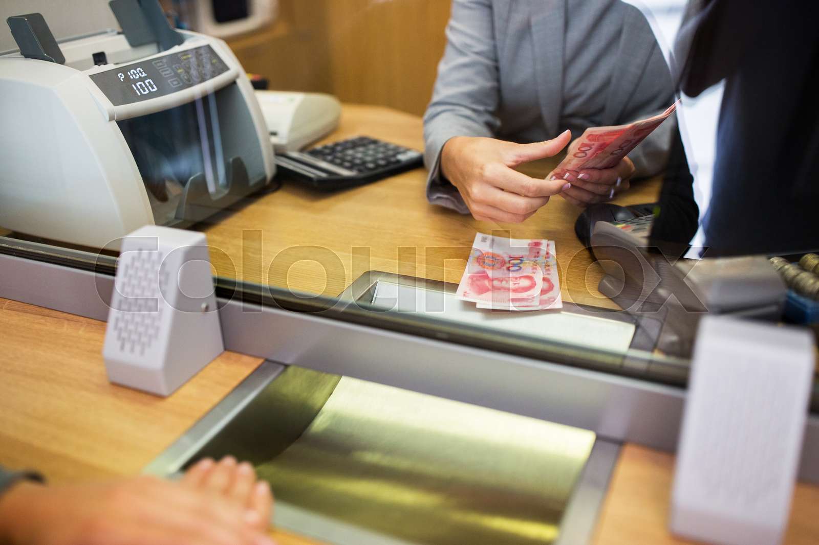 clerk counting cash money at bank office | Stock image | Colourbox