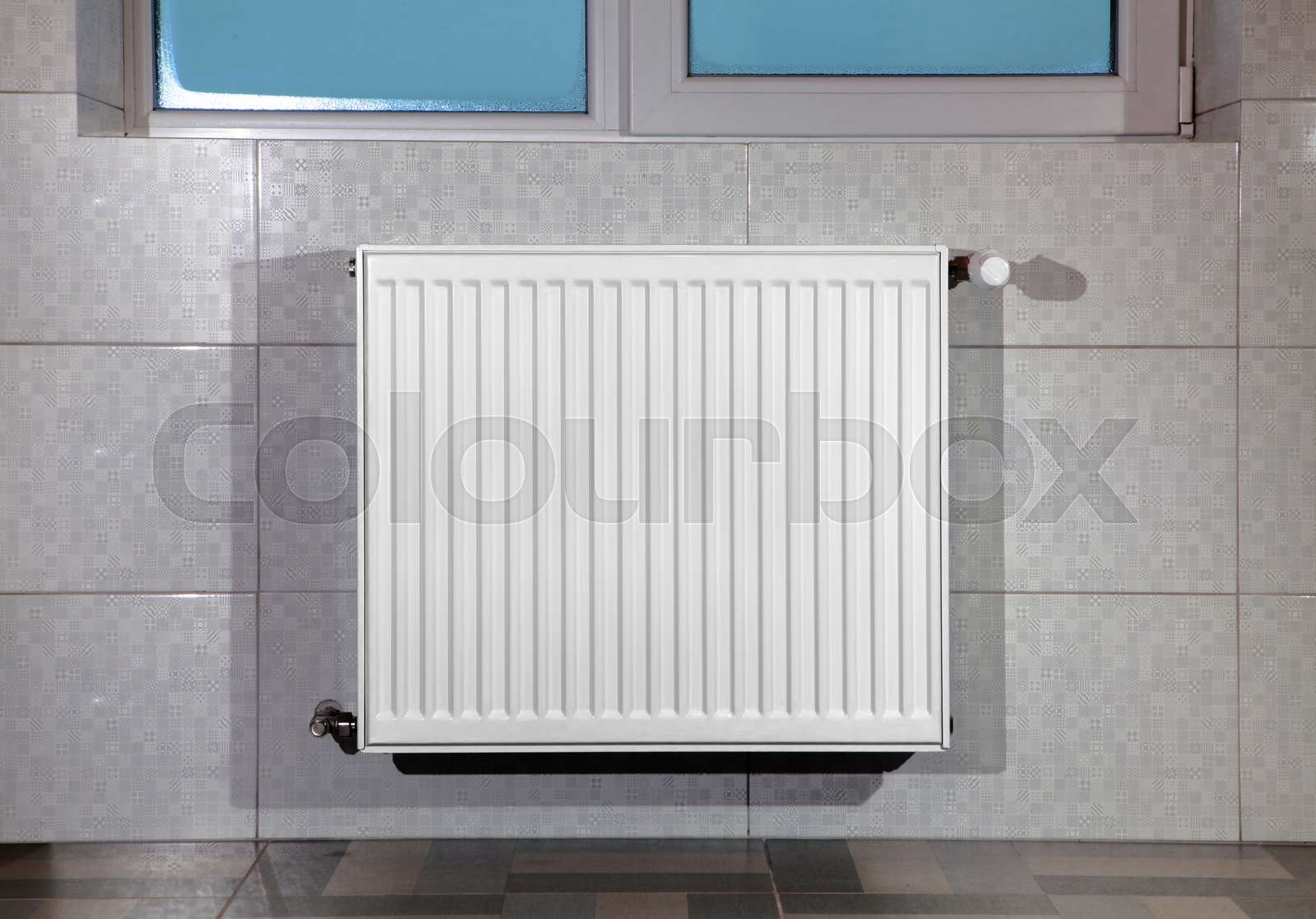 heating radiator under window | Stock image | Colourbox