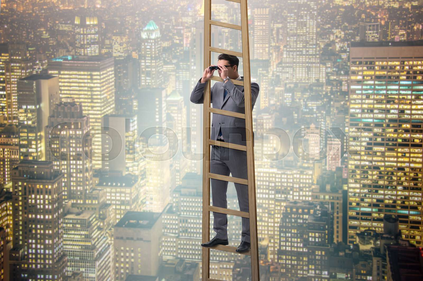 Businessman with binoculars looking into future | Stock image | Colourbox