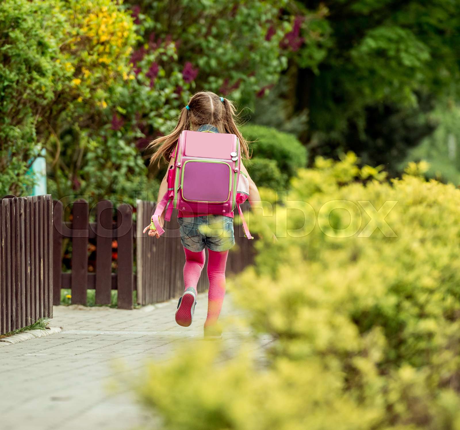 little girl run to school | Stock image | Colourbox