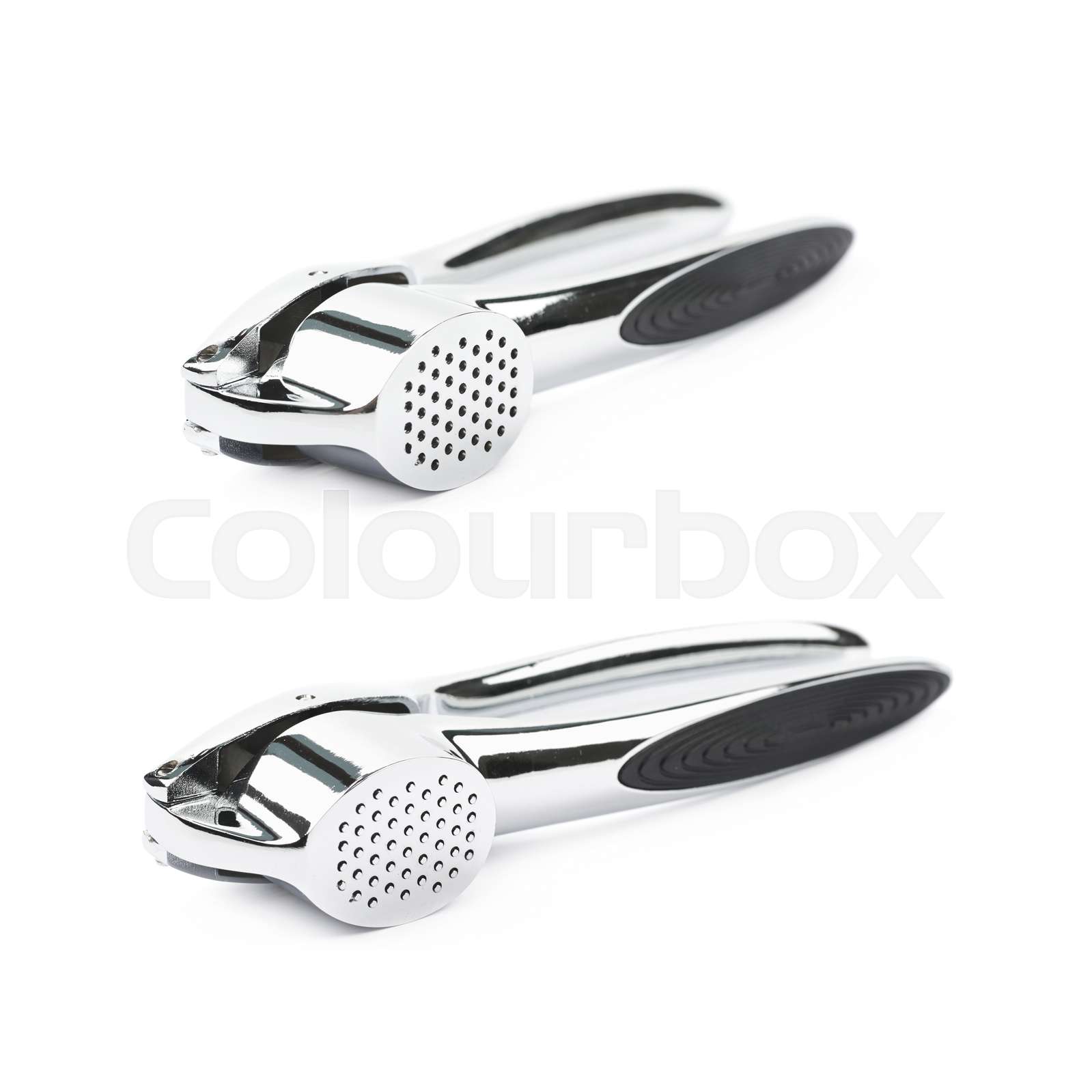 Metal garlic press utensil isolated | Stock image | Colourbox
