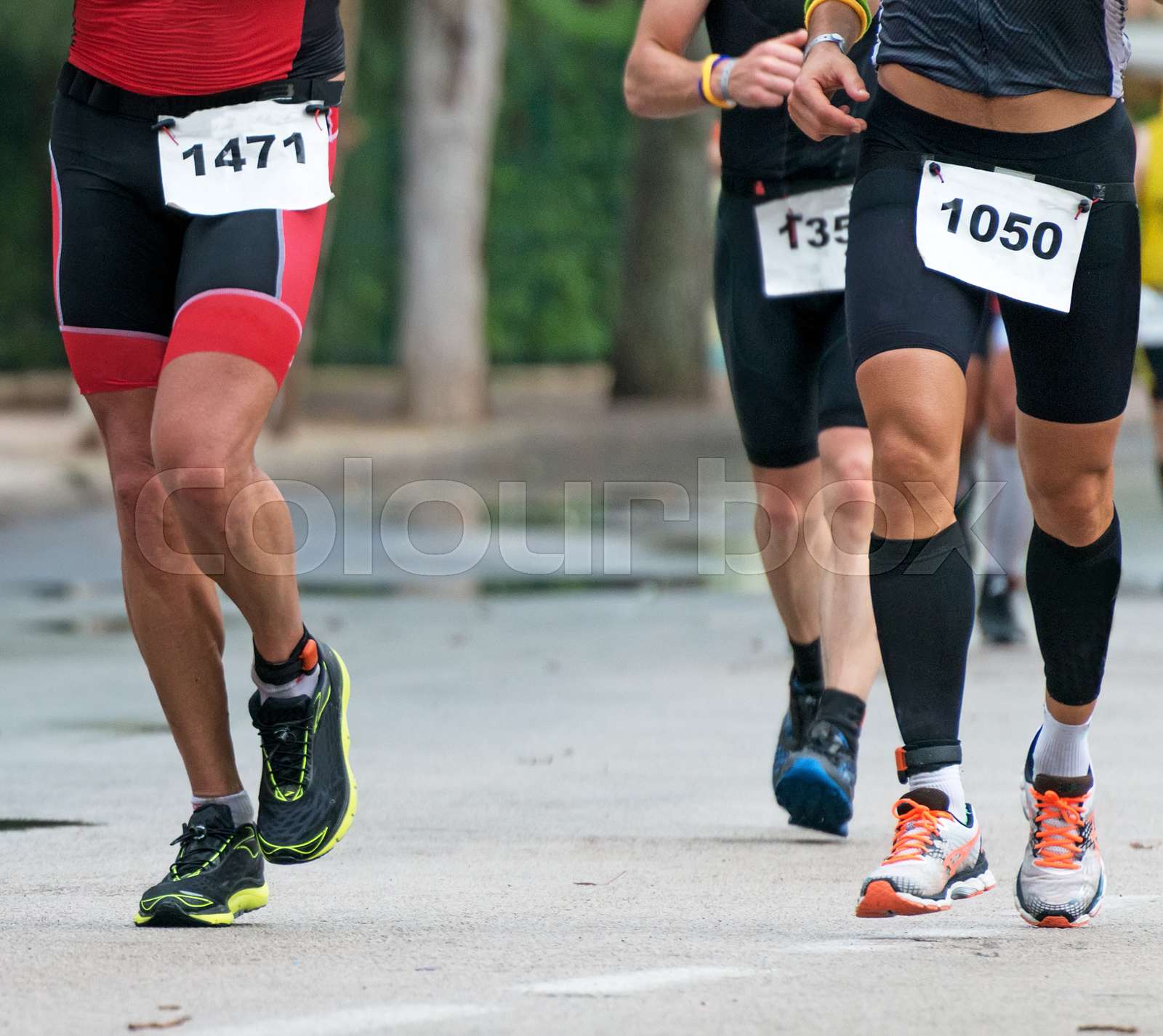 Group of marathon runners on the street. | Stock image | Colourbox