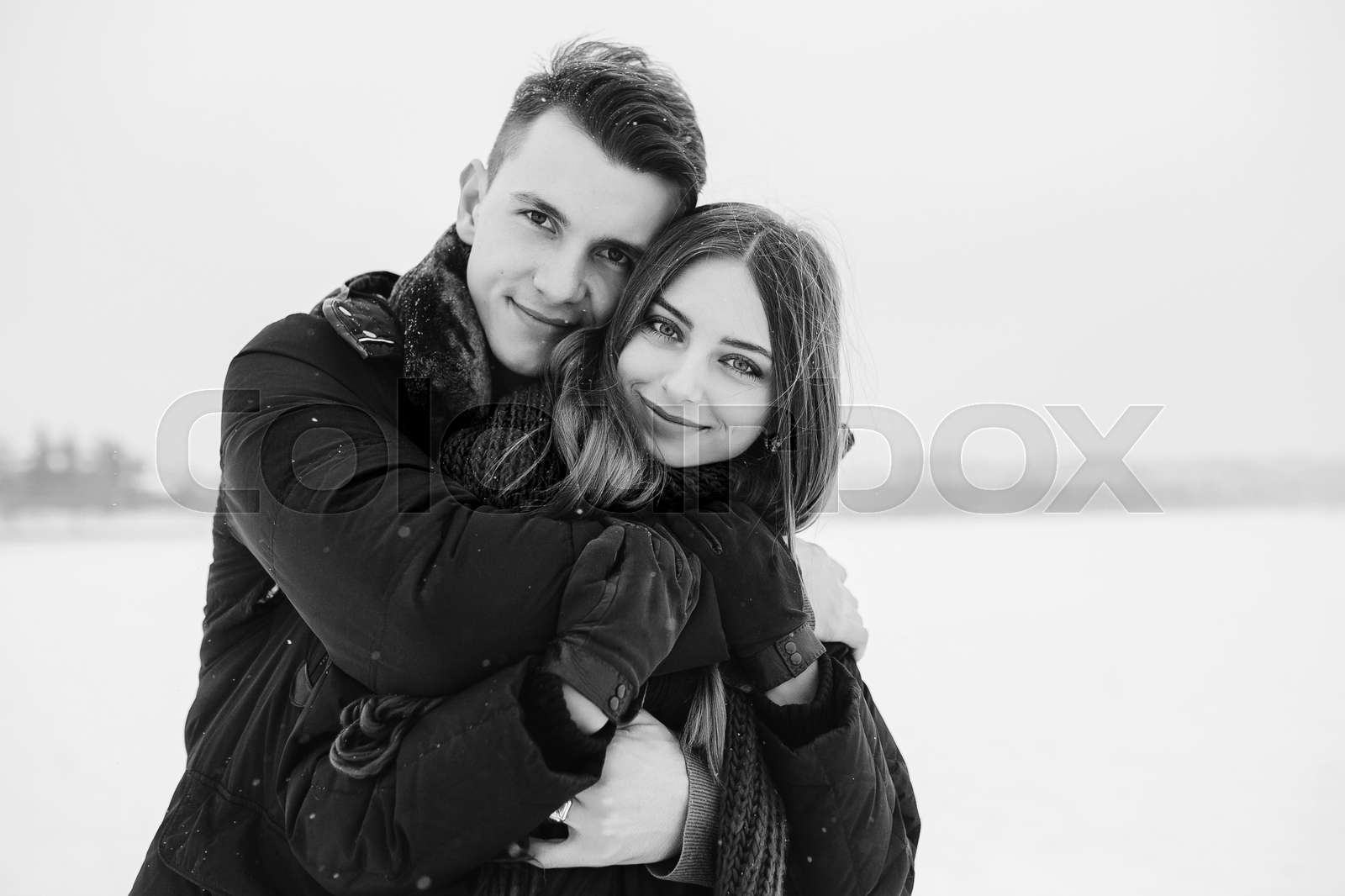 Guy Hugging His Girlfriend From Behind Stock Image Colourbox