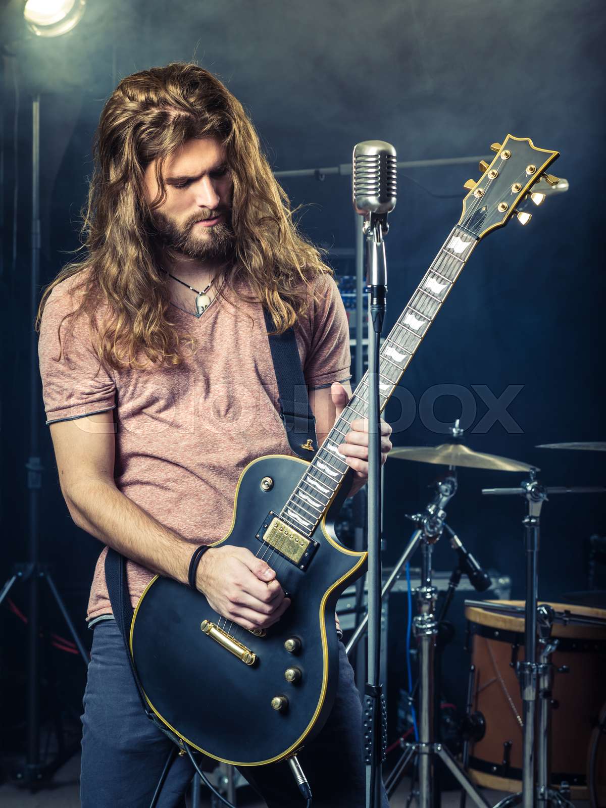 Guitarist rocking on stage | Stock image | Colourbox