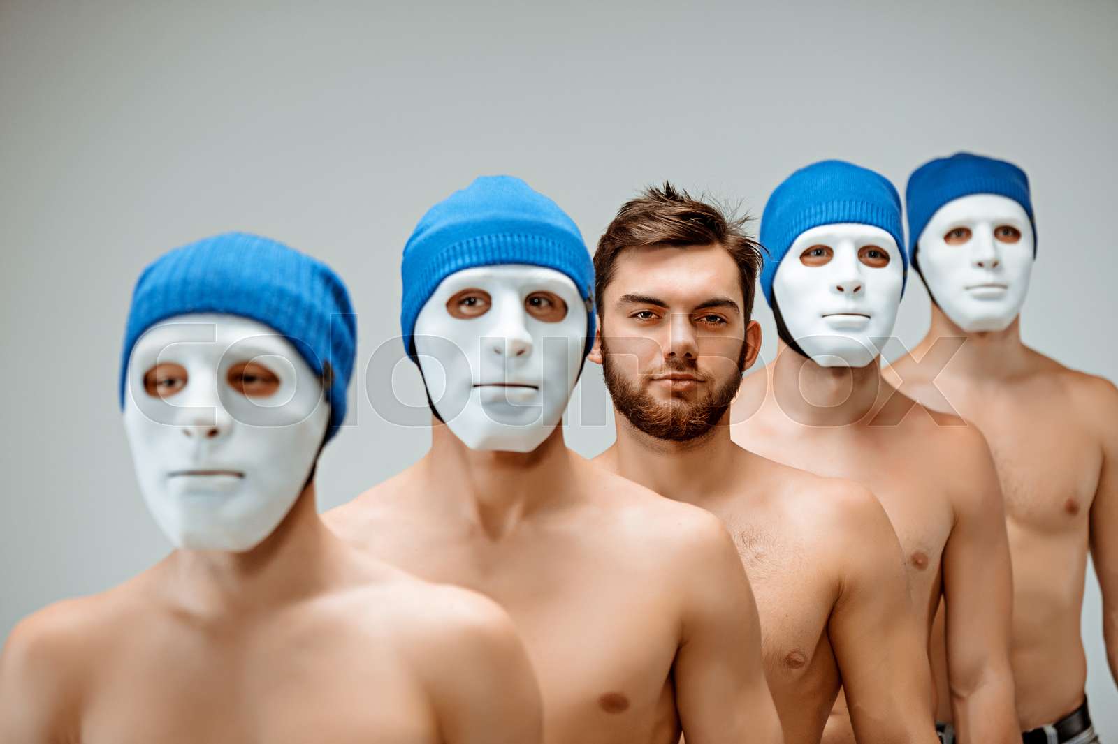The people in masks and one man without mask | Stock image | Colourbox