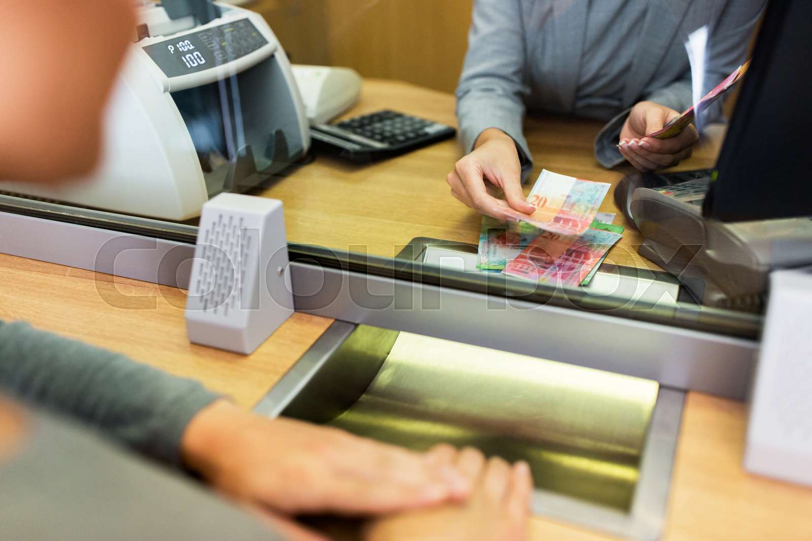 clerk counting cash money at bank office | Stock image | Colourbox