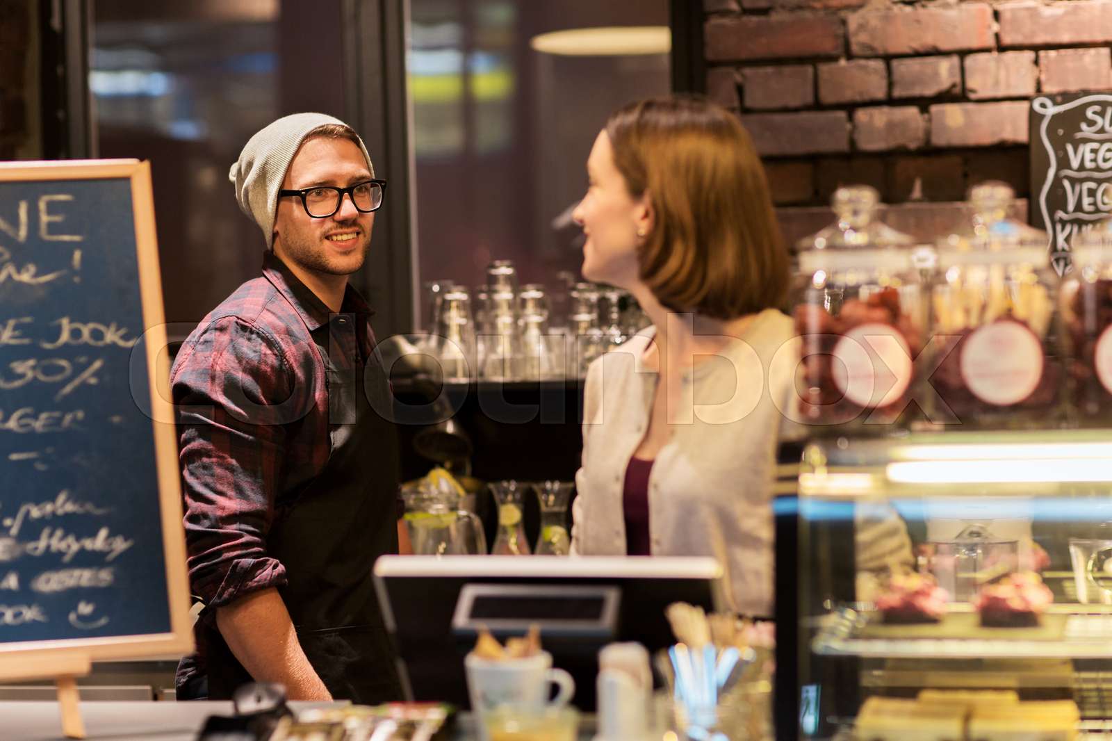 happy bartenders at cafe or coffee shop counter | Stock image | Colourbox