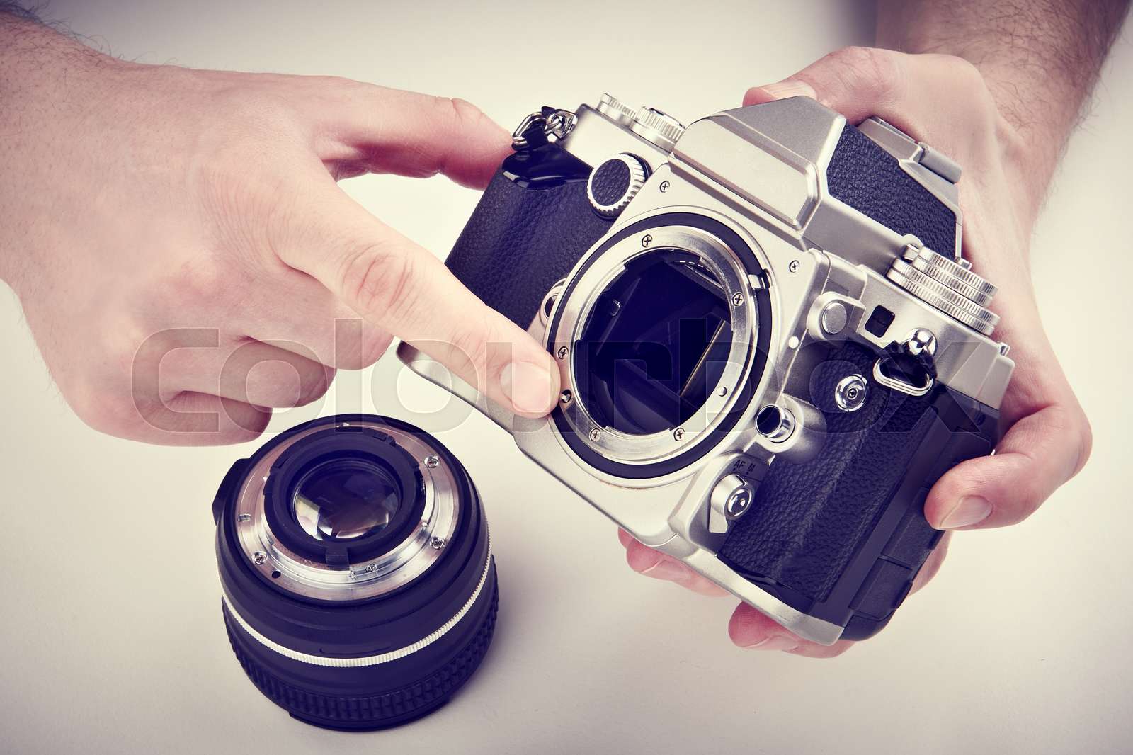 Photographer shows the mechanism of auto focus SLR camera | Stock image ...