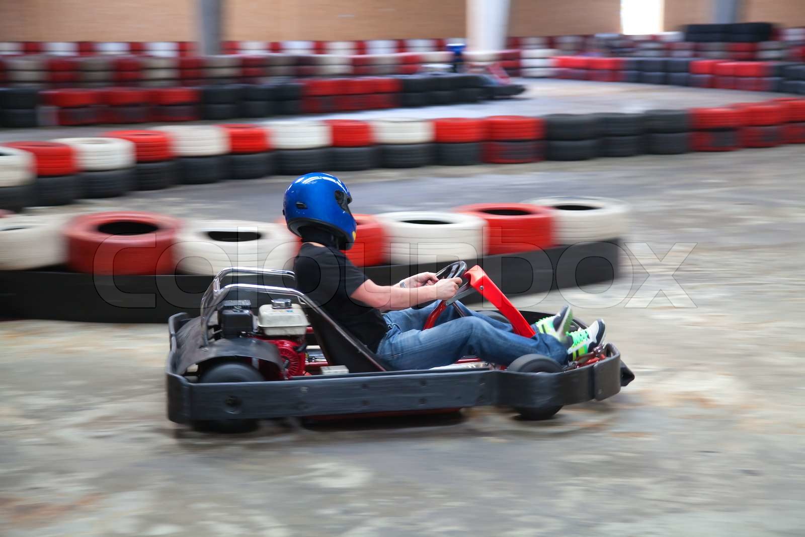 Racing go-kart on indoor track | Stock image | Colourbox