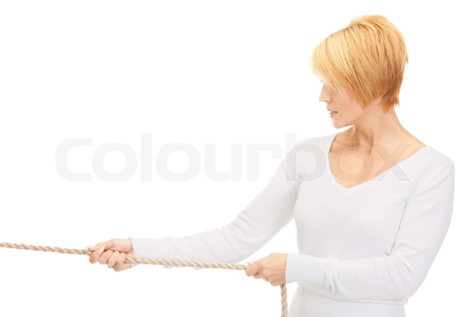 bright picture of business woman pulling rope | Stock image | Colourbox